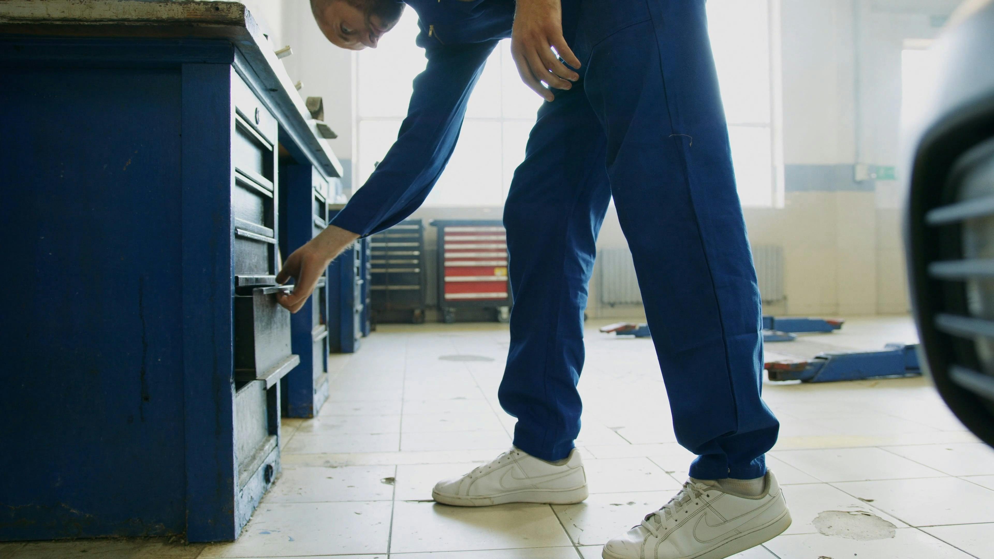 A Man Opening and Closing Drawers from a Cabinet Free Stock Video ...