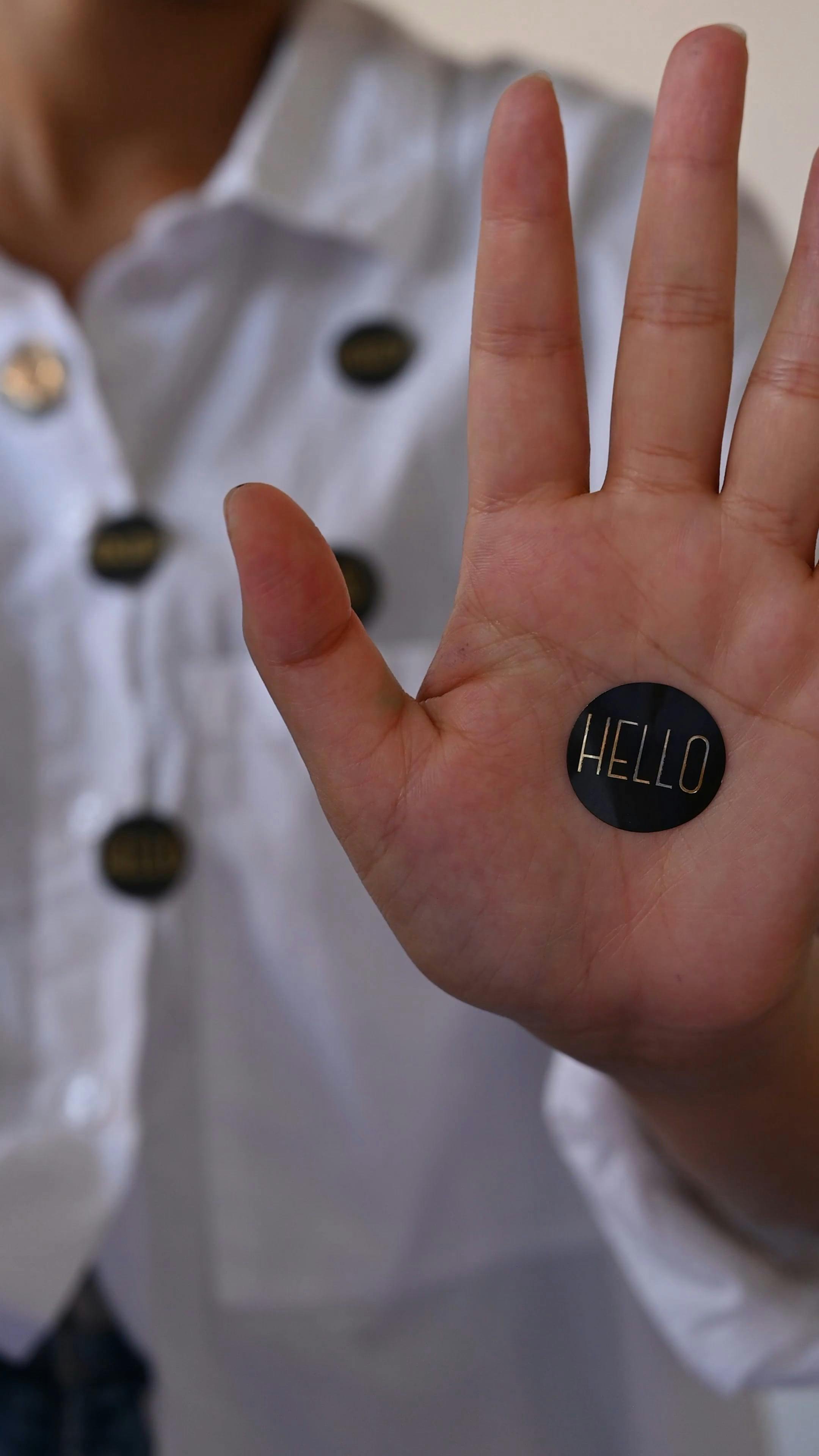A Person's Hand With Hello Sticker Free Stock Video Footage, Royalty ...
