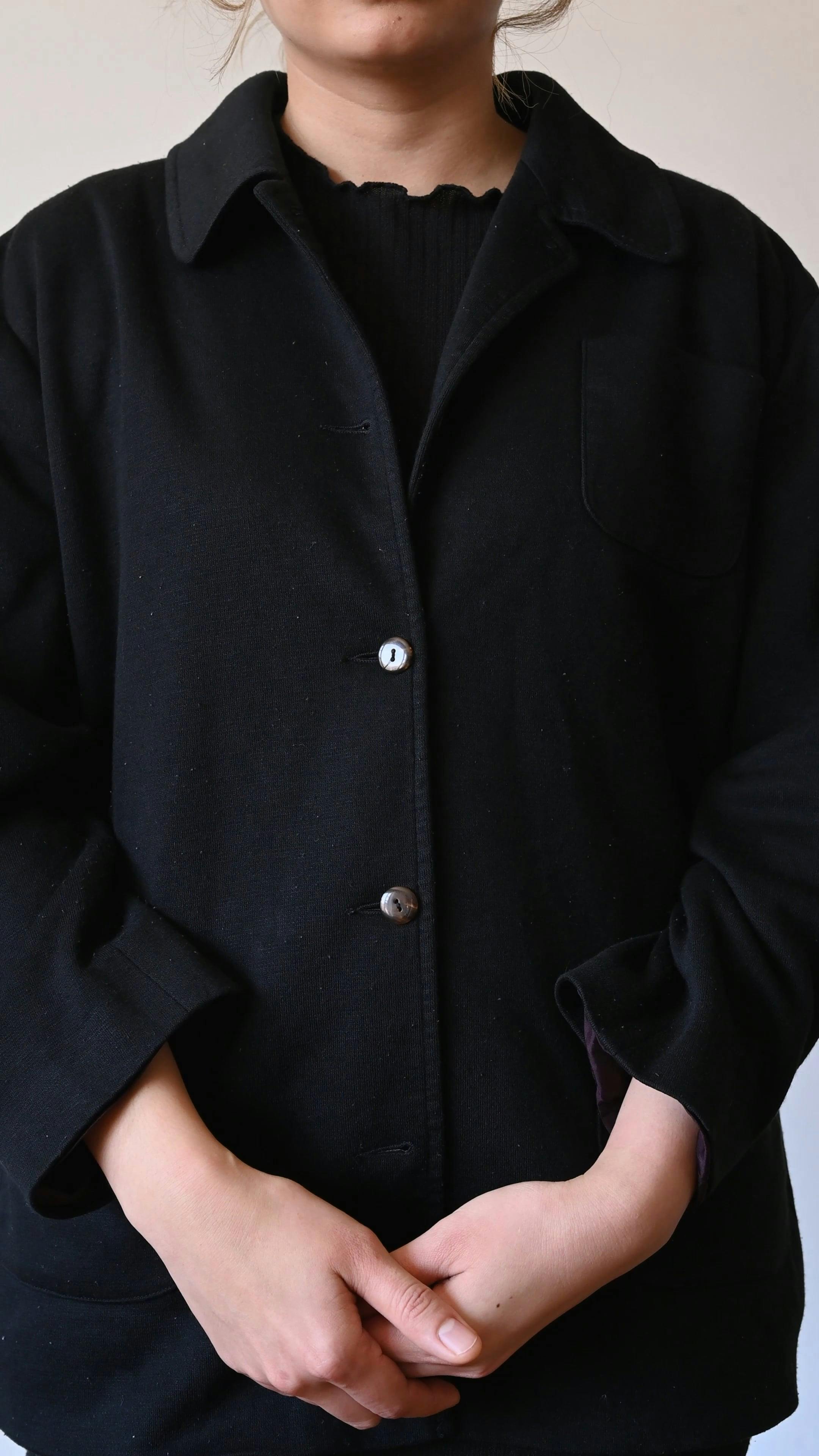 A Person Wearing Black Coat Using Sign Language to Communicate Free ...