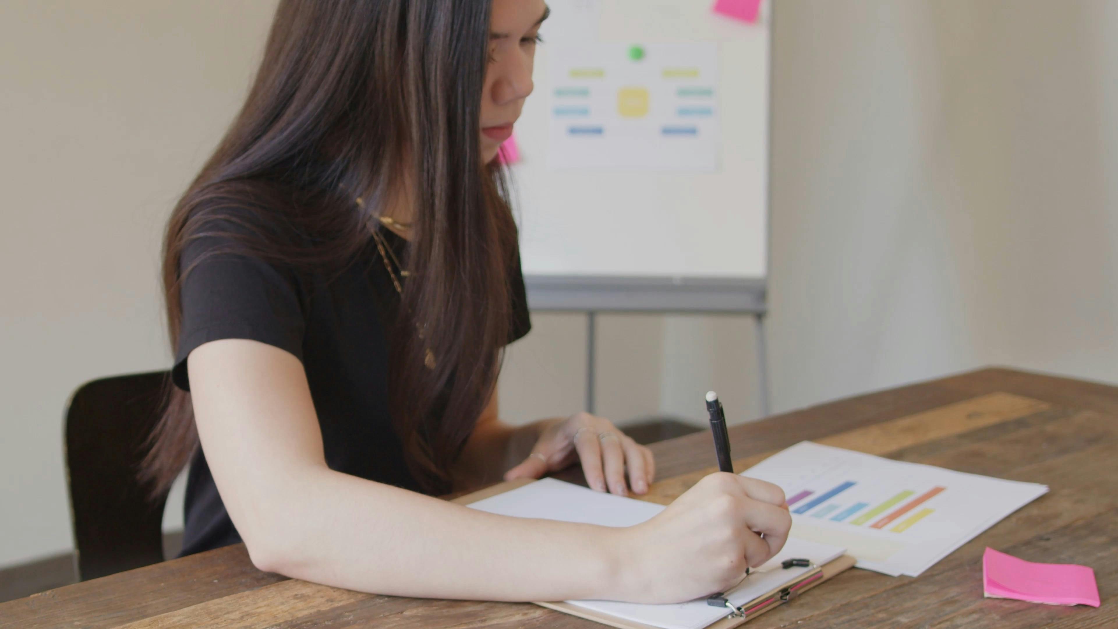 A Woman Writing on a Paper Free Stock Video Footage, Royalty-Free 4K ...