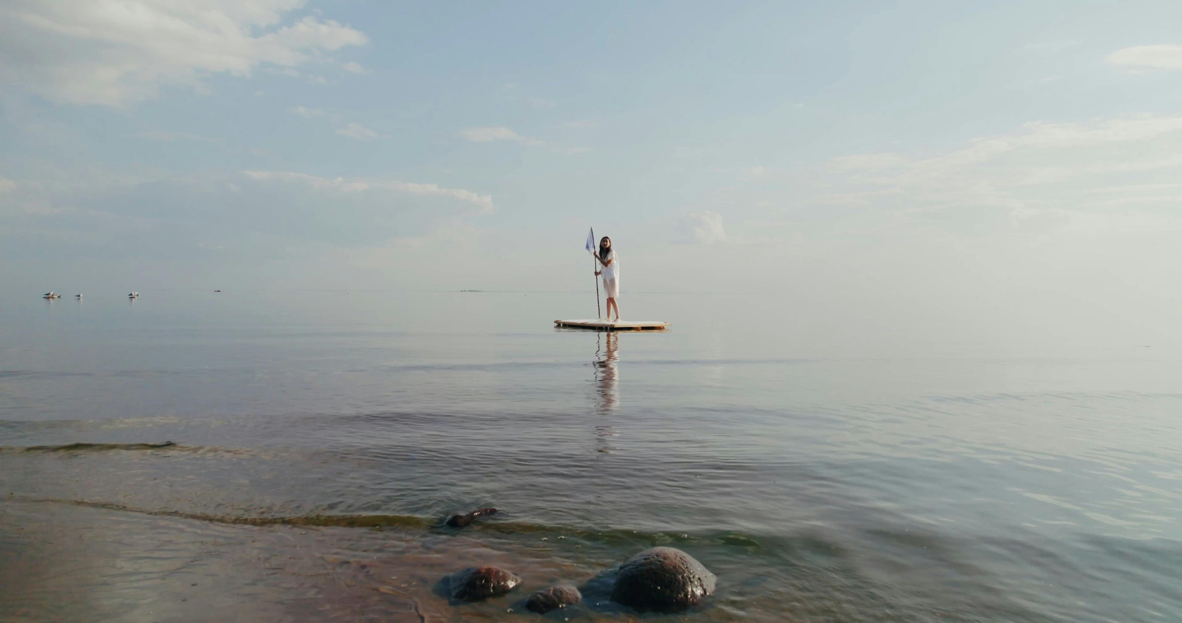 A Woman Standing on the Raft Free Stock Video Footage, Royalty-Free 4K ...