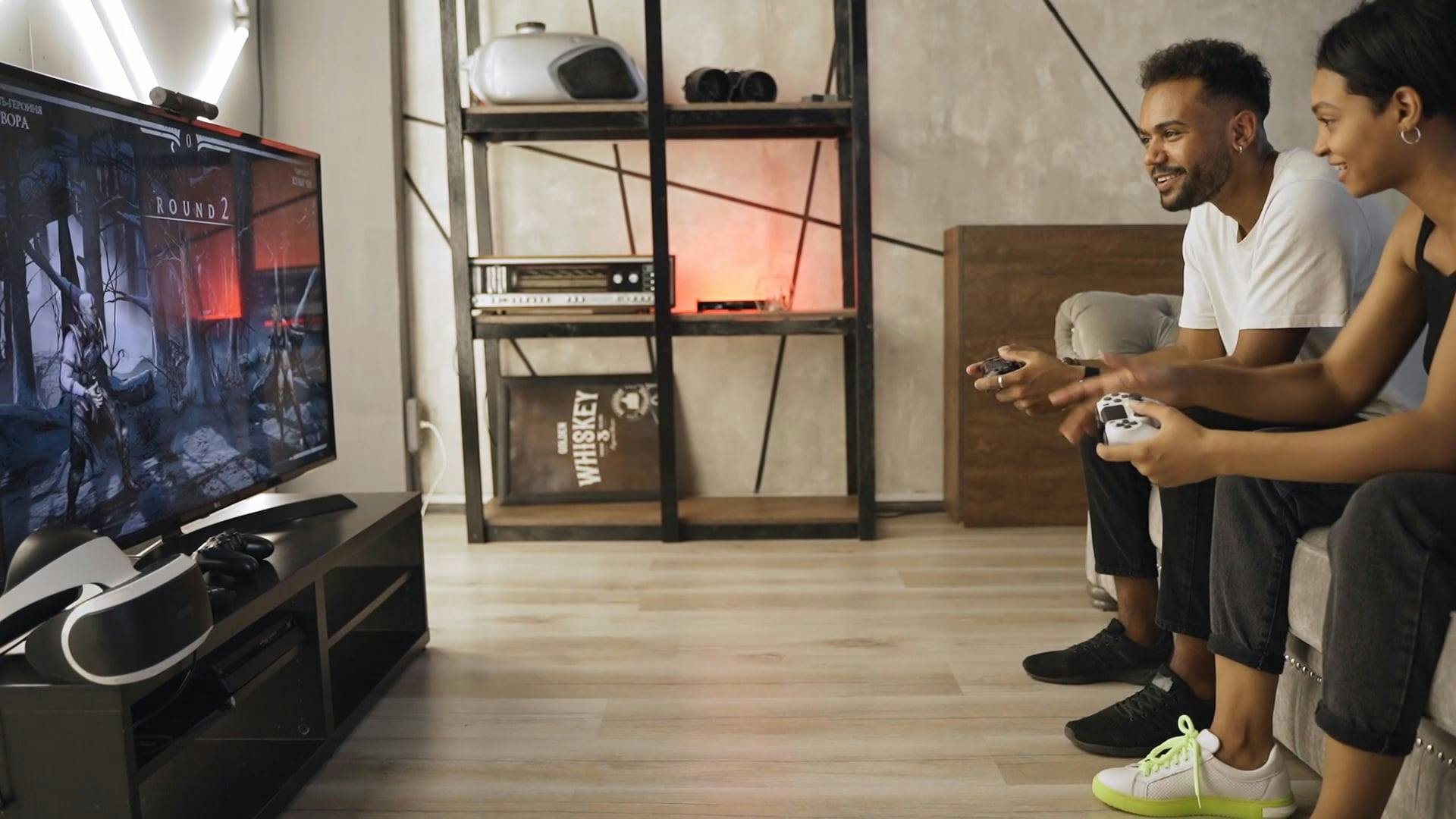 People Having Conversation While Playing Video Games · Free Stock Video