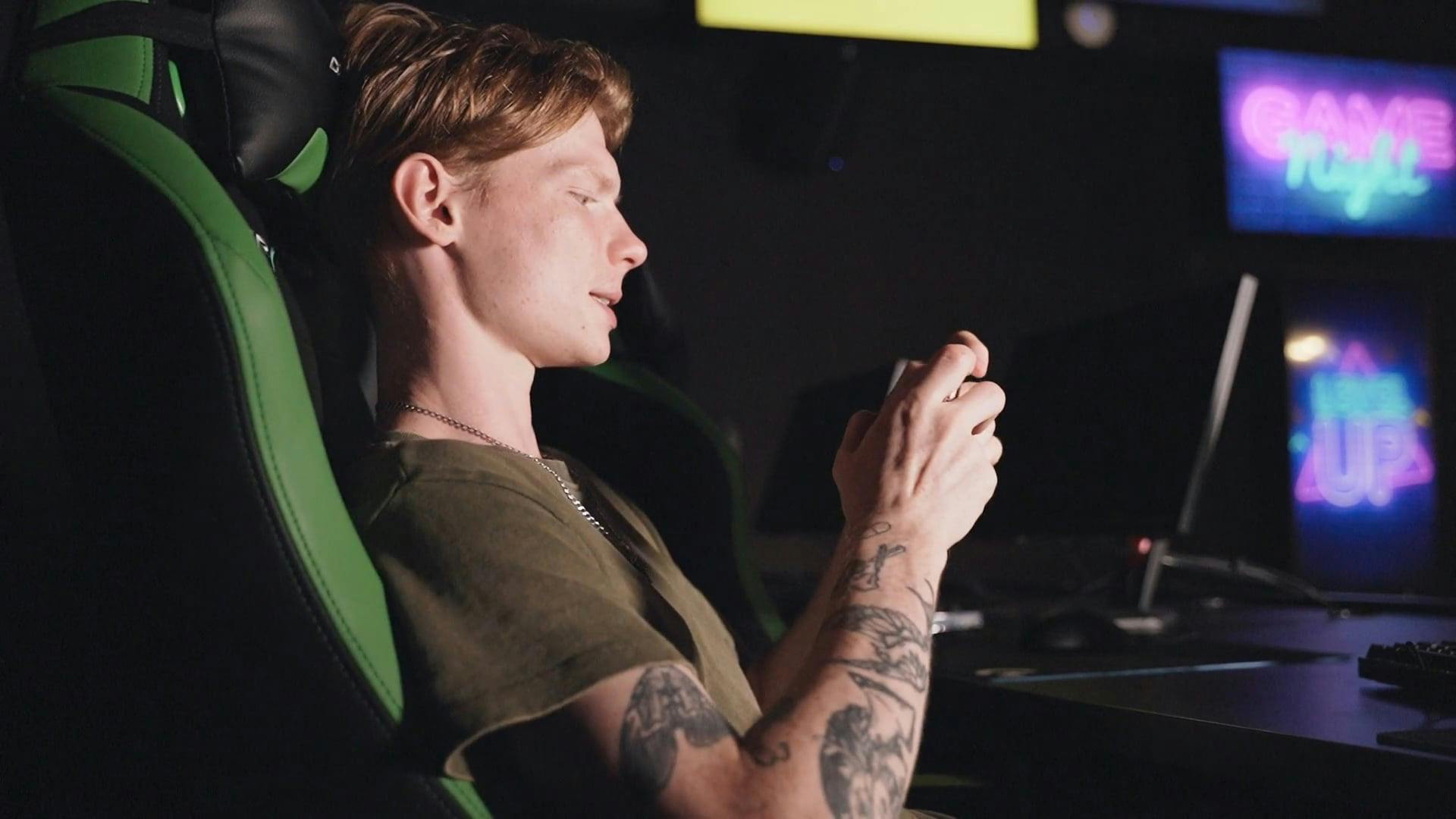 Man Sitting on Gaming Chair While Playing Mobile Game Free Stock Video ...