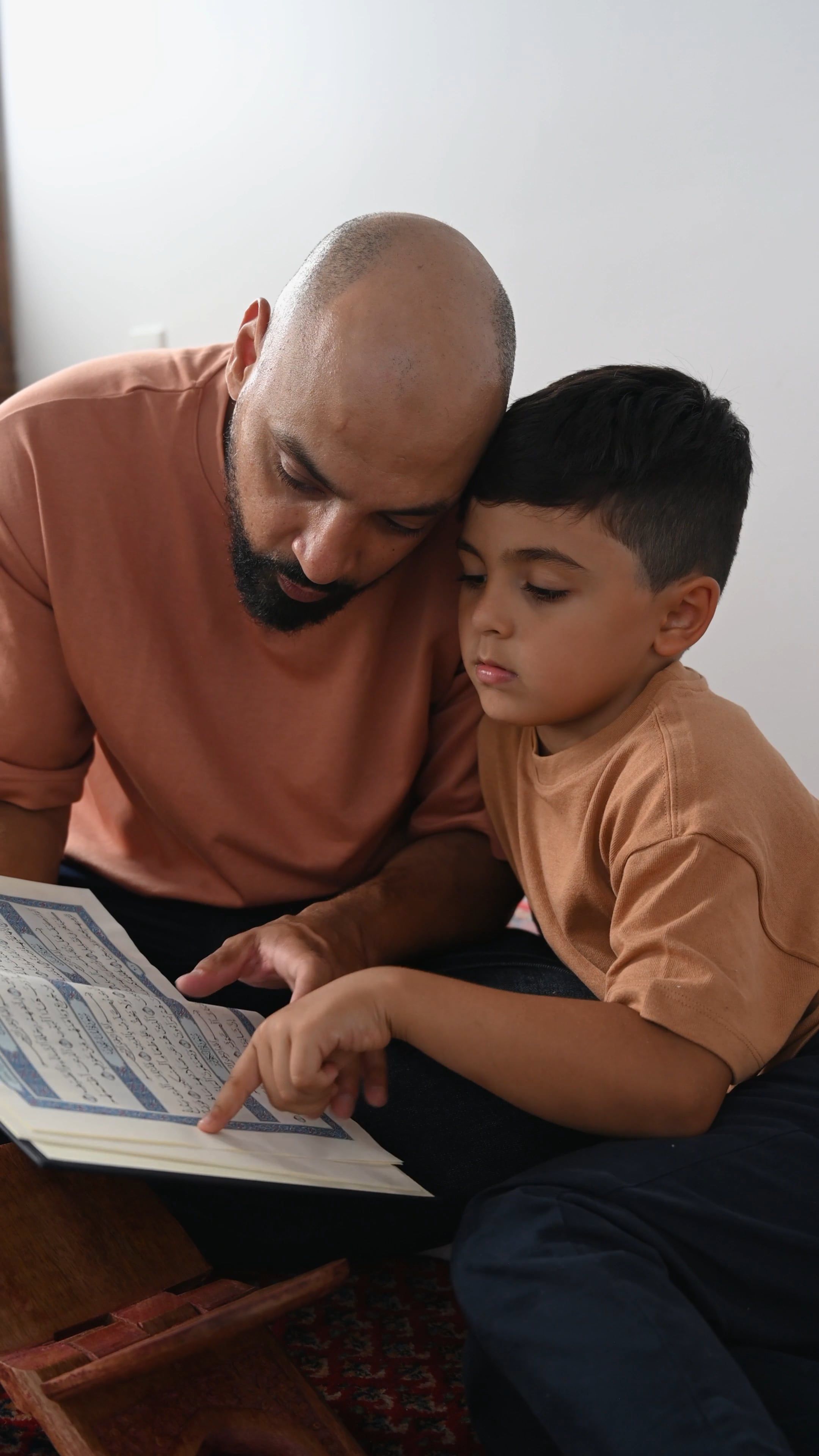 A Father Teaching His Son How to Read · Free Stock Video