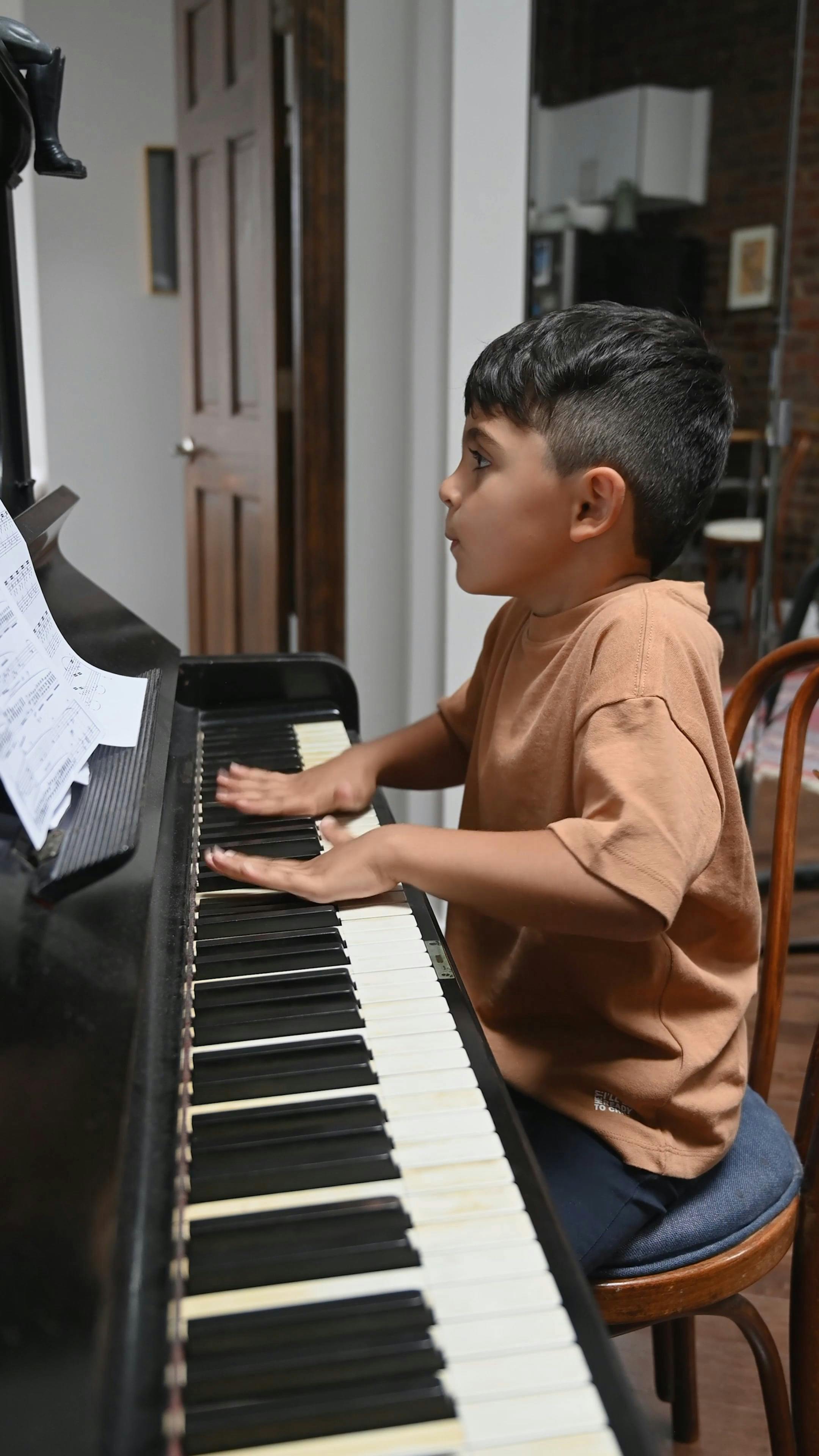 A Boy Tapping the Piano Keys Free Stock Video Footage, Royalty-Free 4K ...