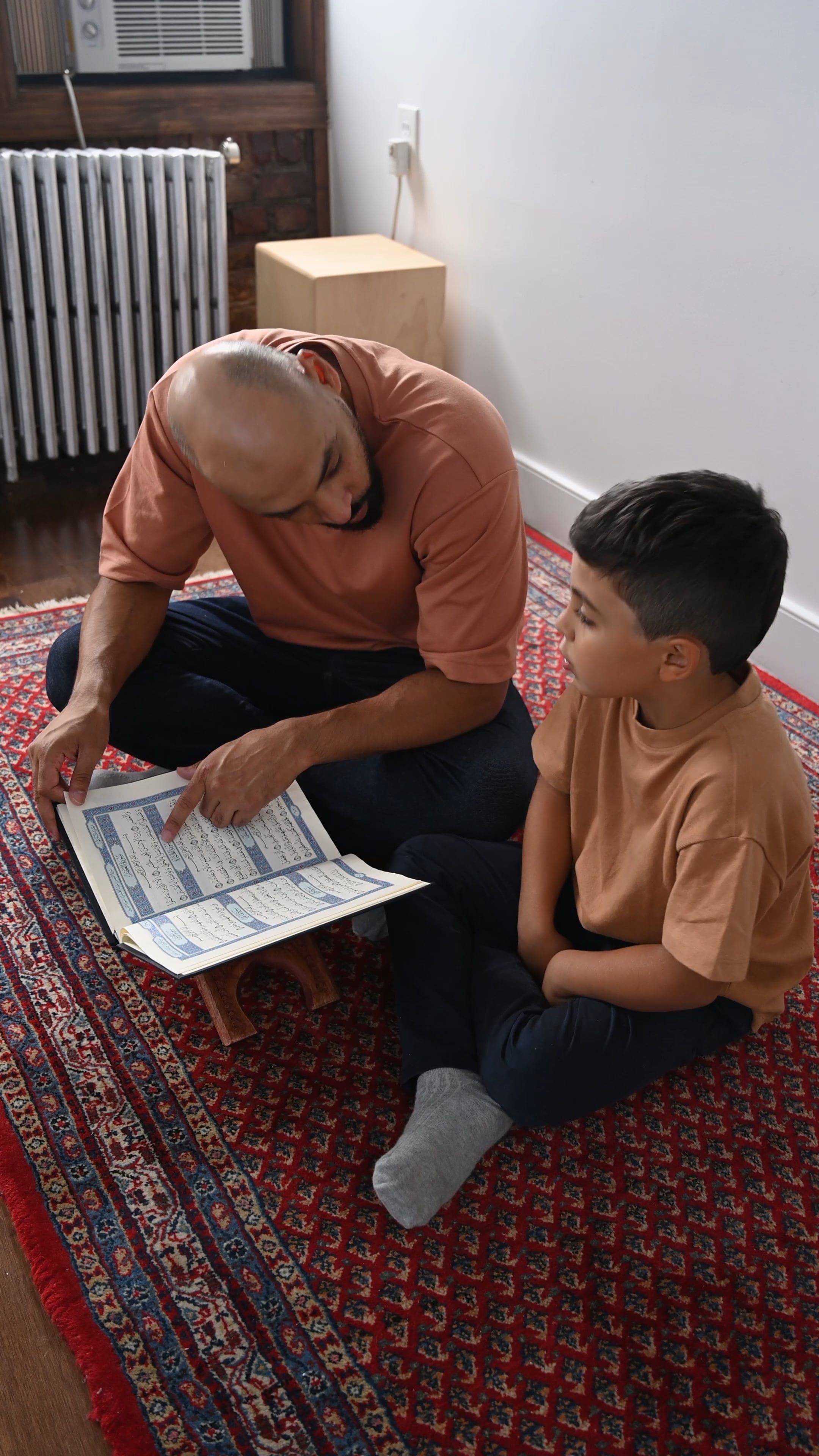 A Father Teaching His Son while Sitting on the Carpet Free Stock Video ...