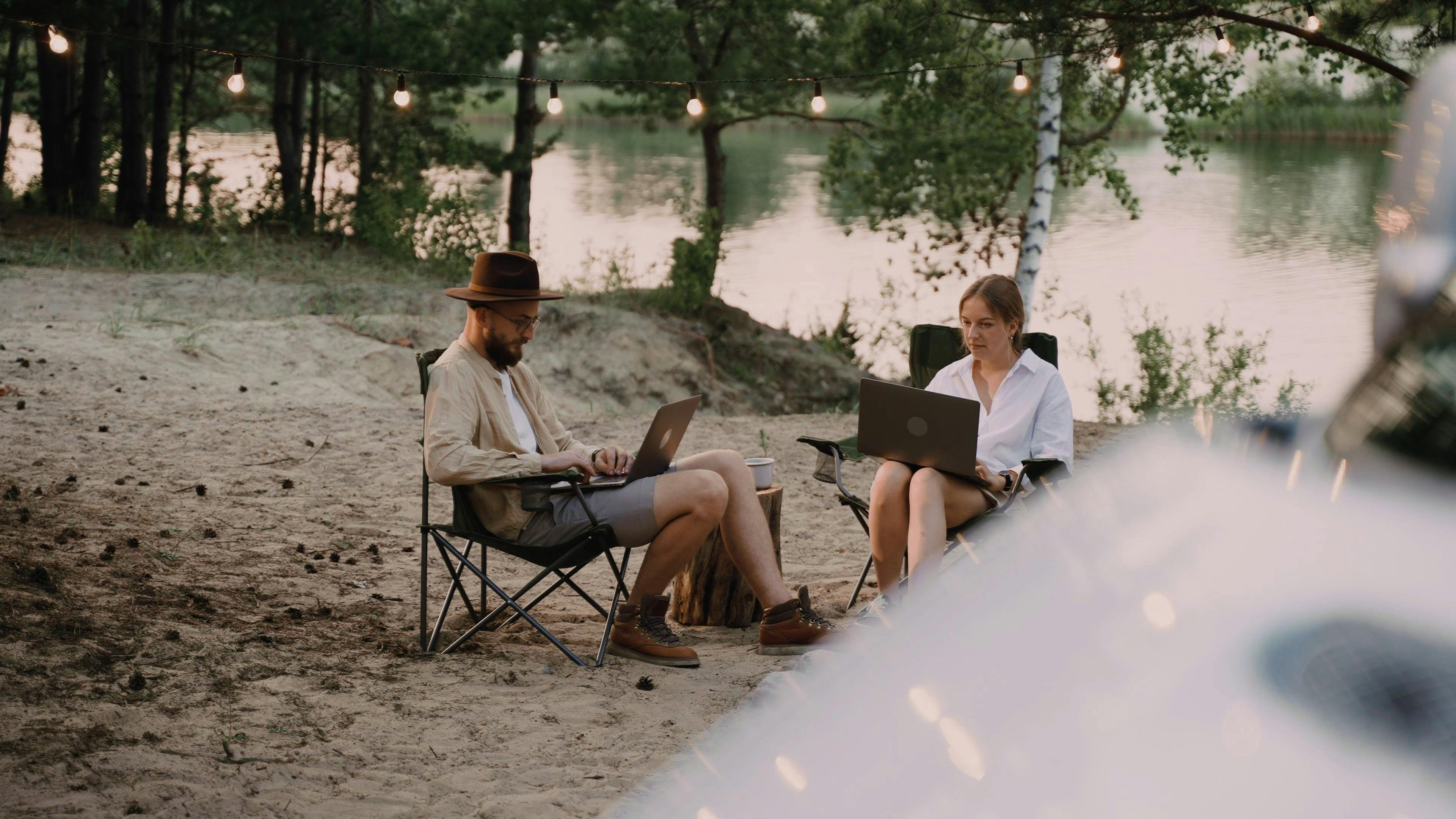 A Couple Using Laptop Computers at a Camping Site Free Stock Video ...