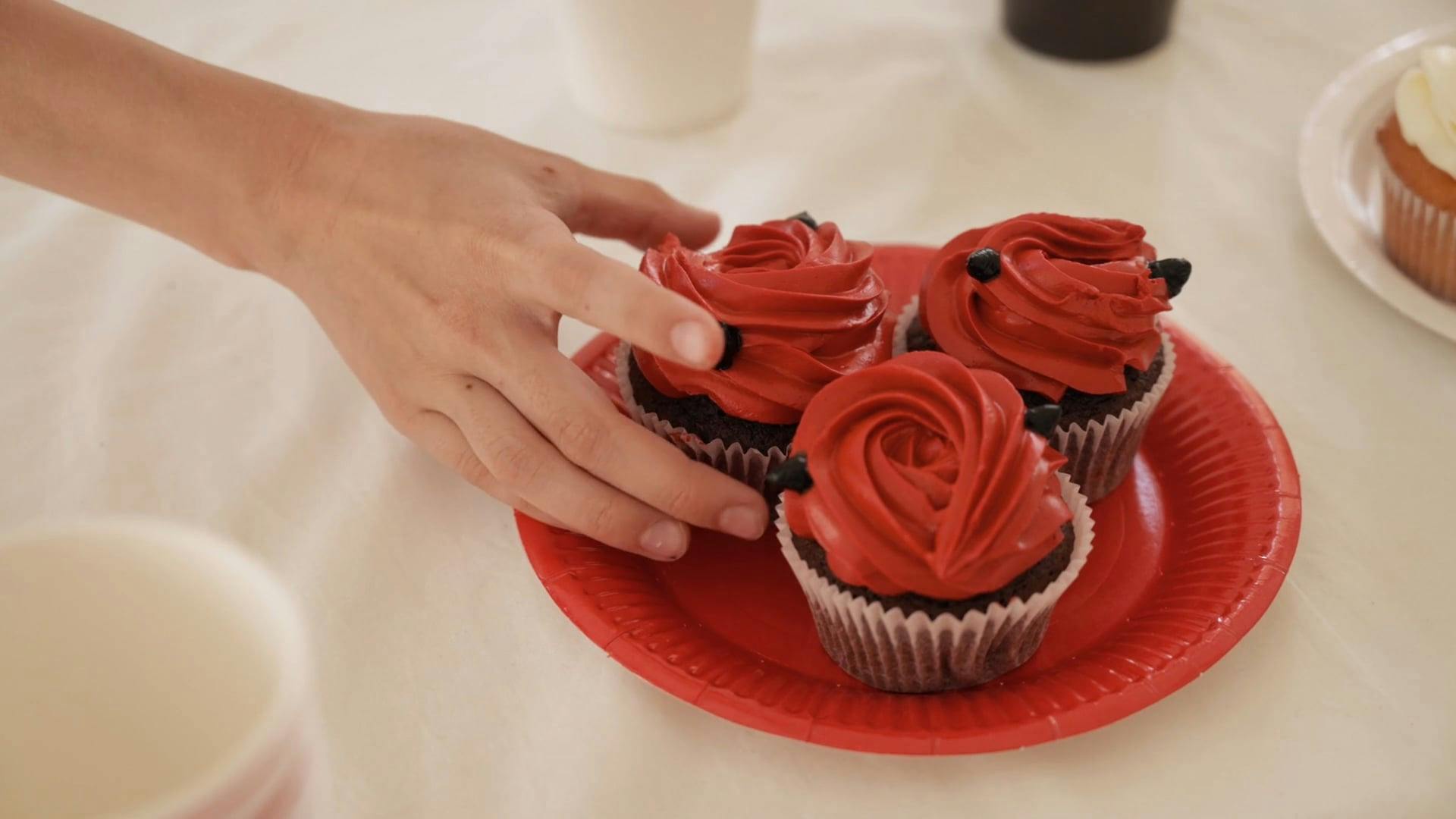 A Person Getting a Cupcake from a Paper Plate Free Stock Video Footage ...