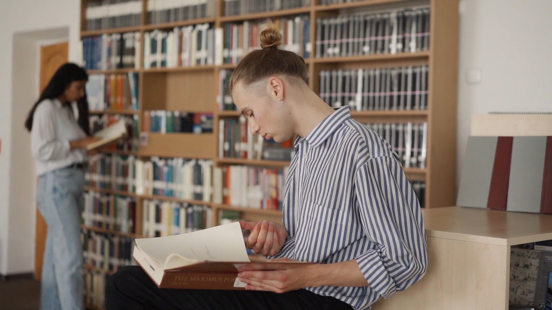 Young People Showing the Books They are Reading to Each Other Free ...