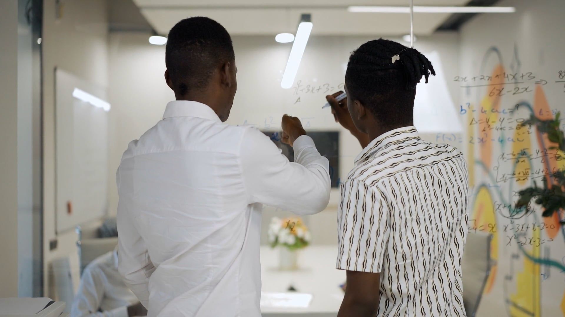 Men Solving Math Problem on a Glass Board Free Stock Video Footage ...