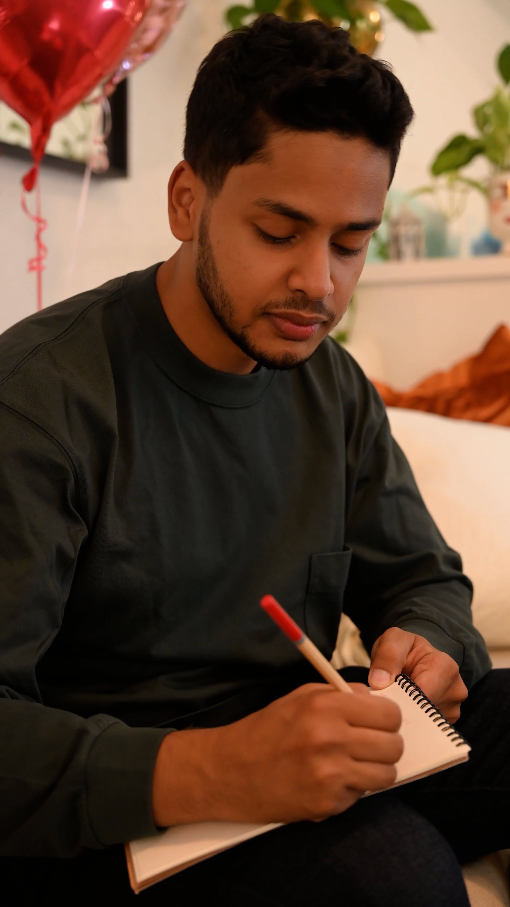 Man Wearing Sweater Writing on a Notepad Free Stock Video Footage ...
