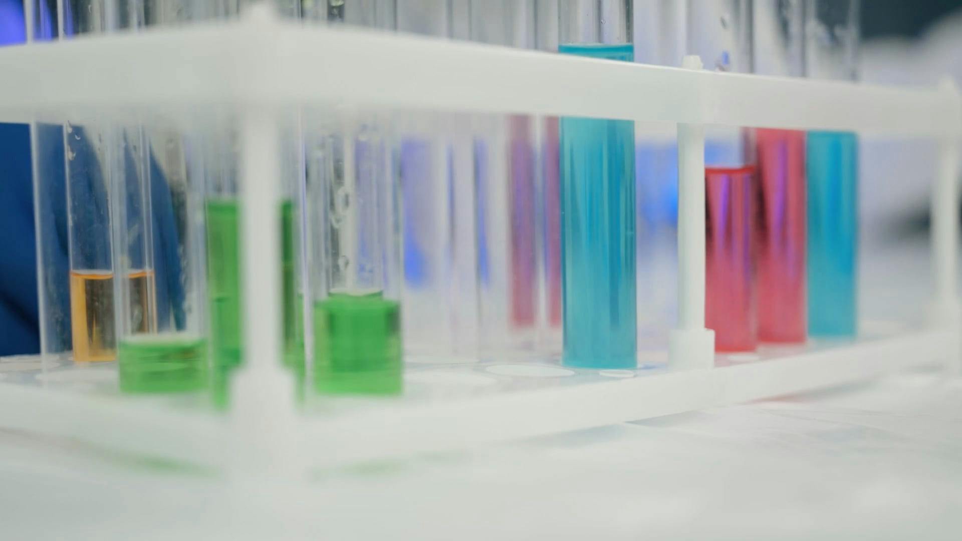 A Man Of Science Observing A Liquid Sample Inside A test Tube · Free ...