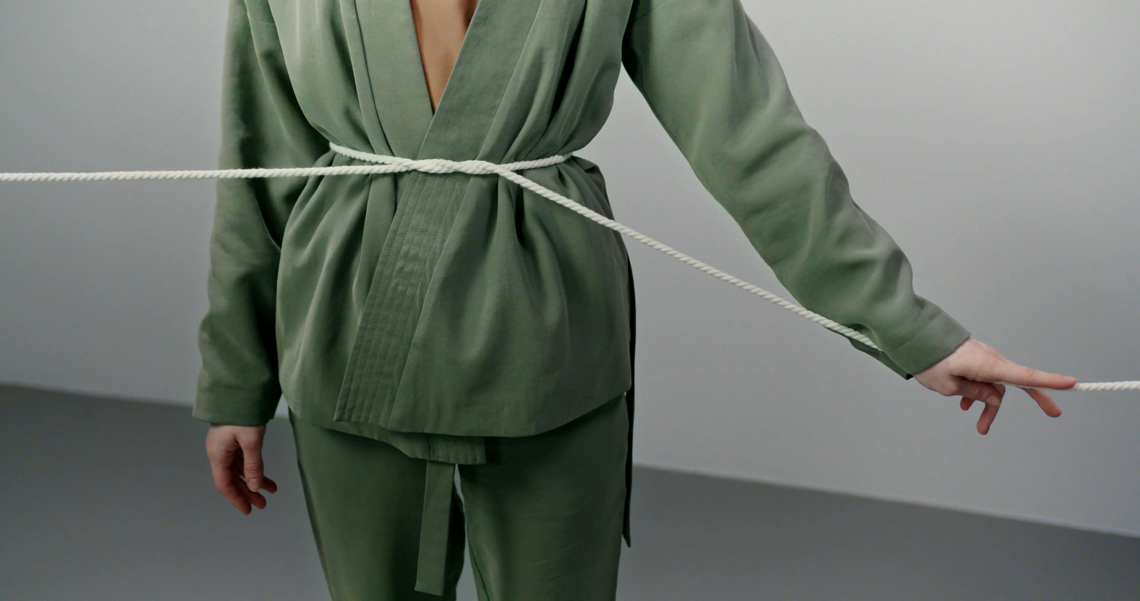 A Woman Turning Around and Wrapping Herself in Rope Free Stock Video ...