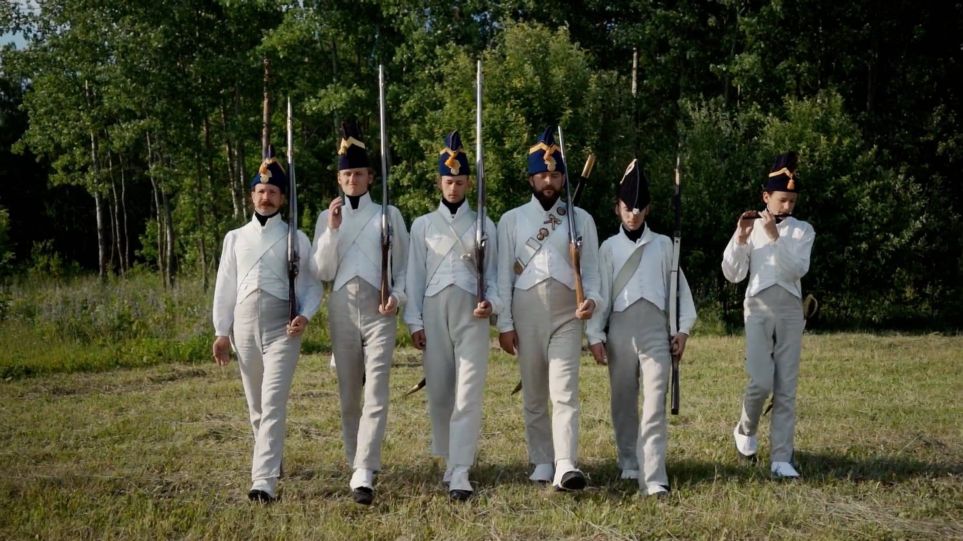 Men Wearing Military Uniform Marching Together in an Open Field Free ...