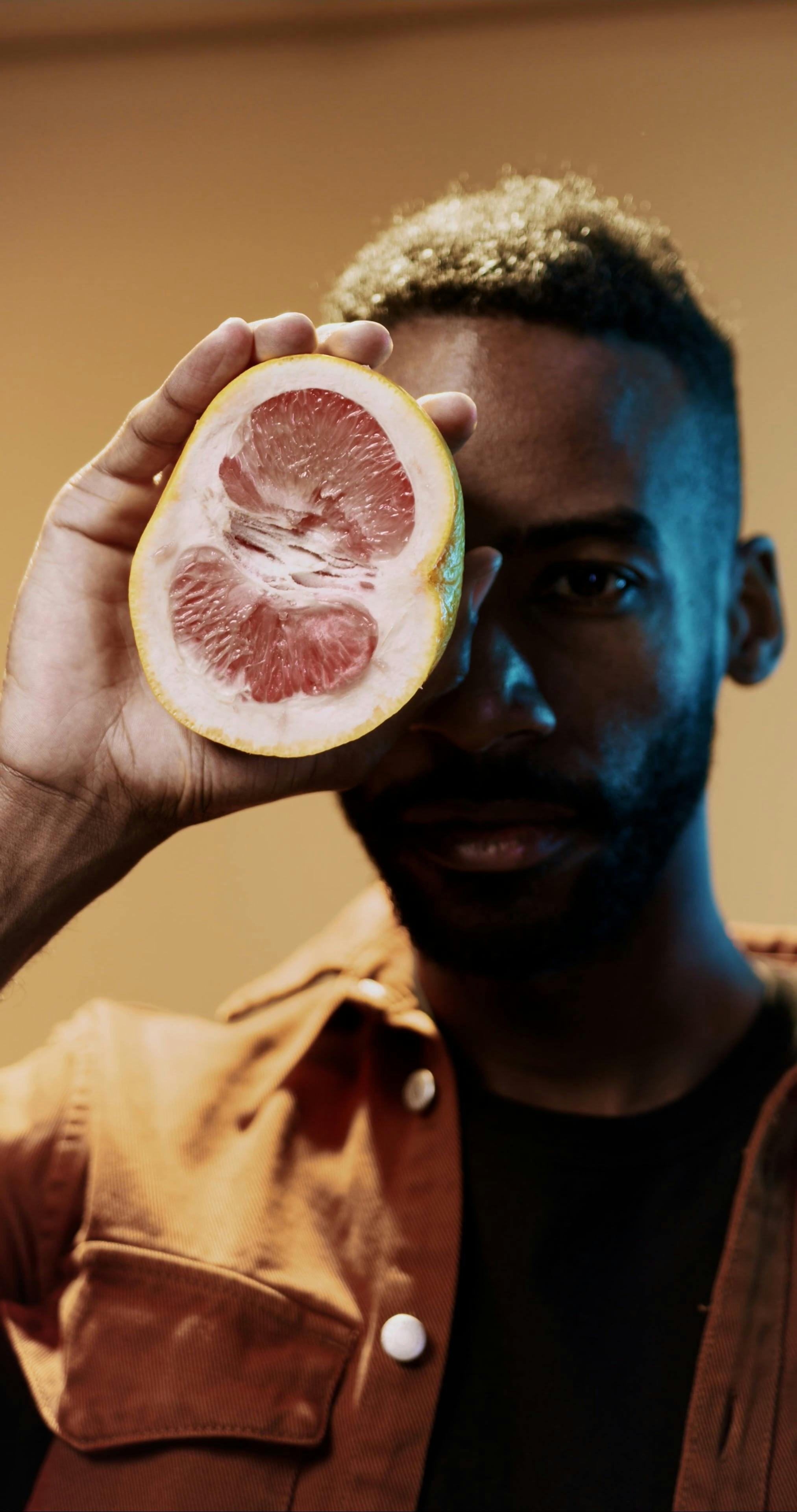A Man Posing with Pomelo Halves Free Stock Video Footage, Royalty-Free ...