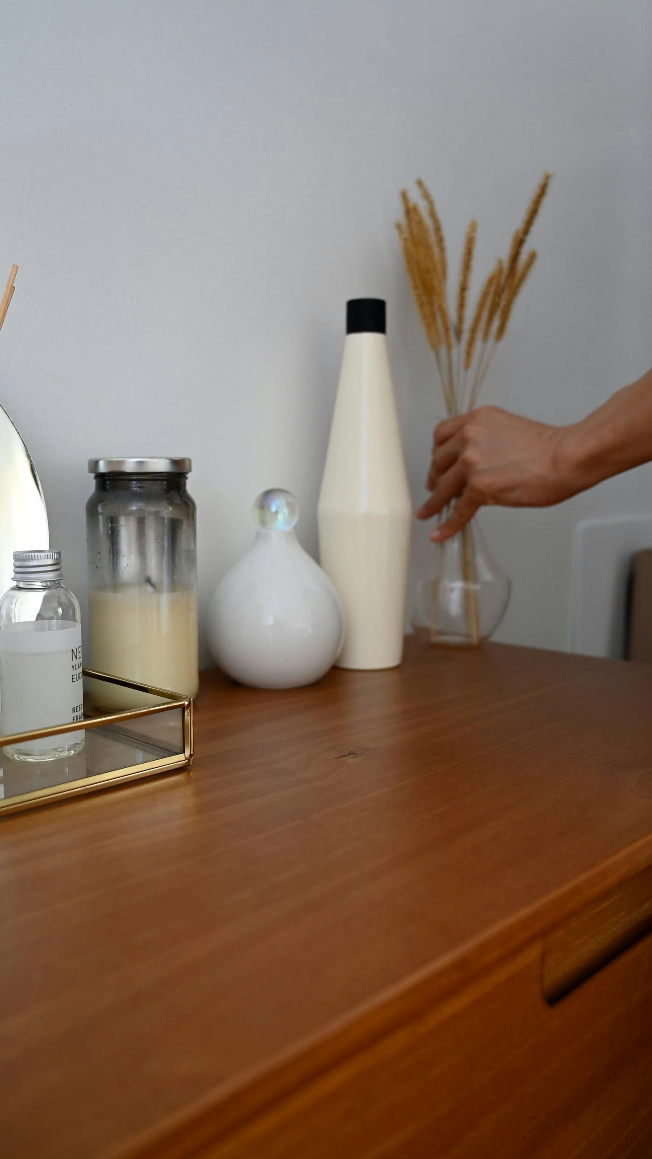 A person is putting lotion on a wooden table Free Stock Video Footage ...