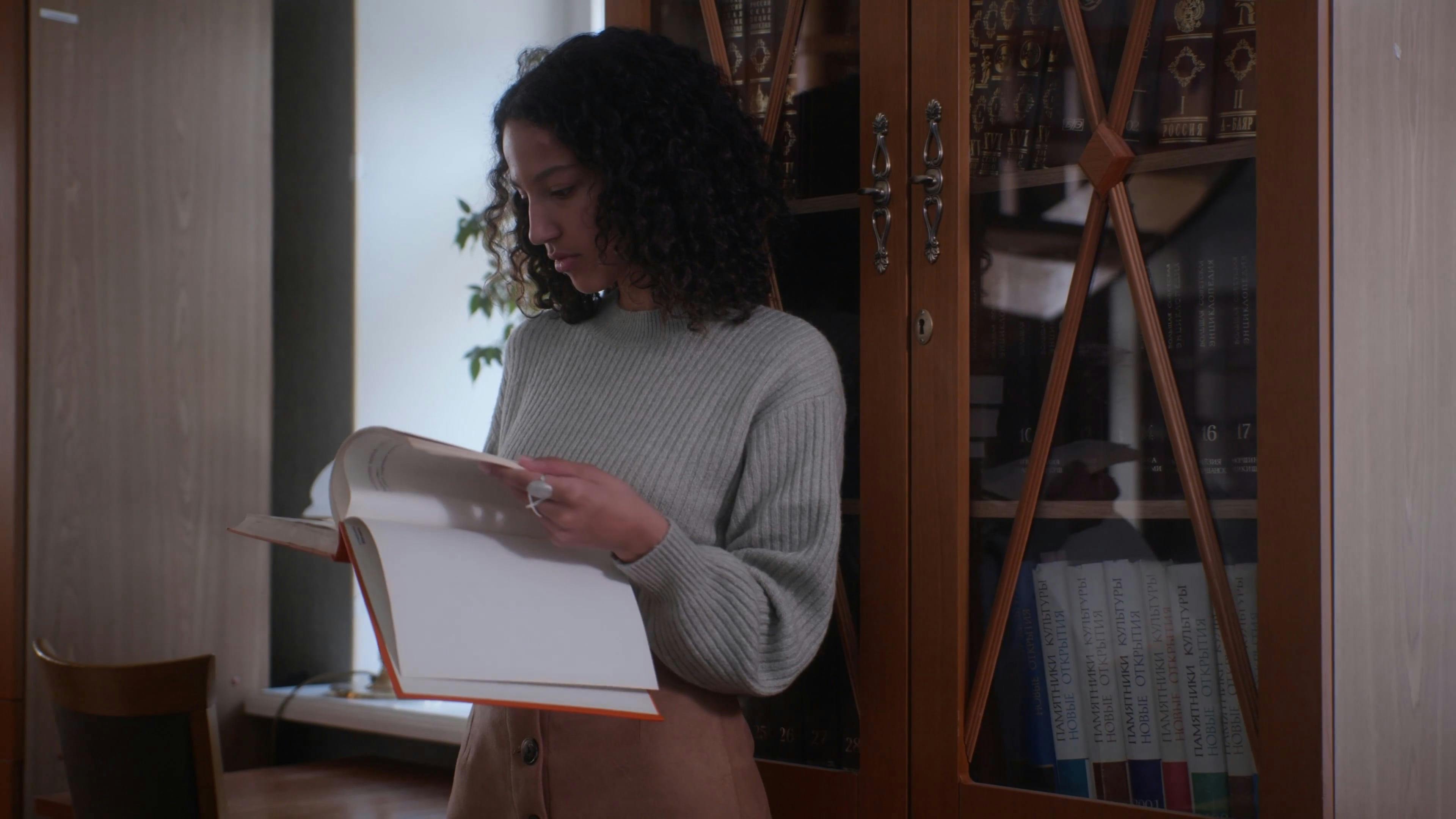 Woman Browsing a Book · Free Stock Video