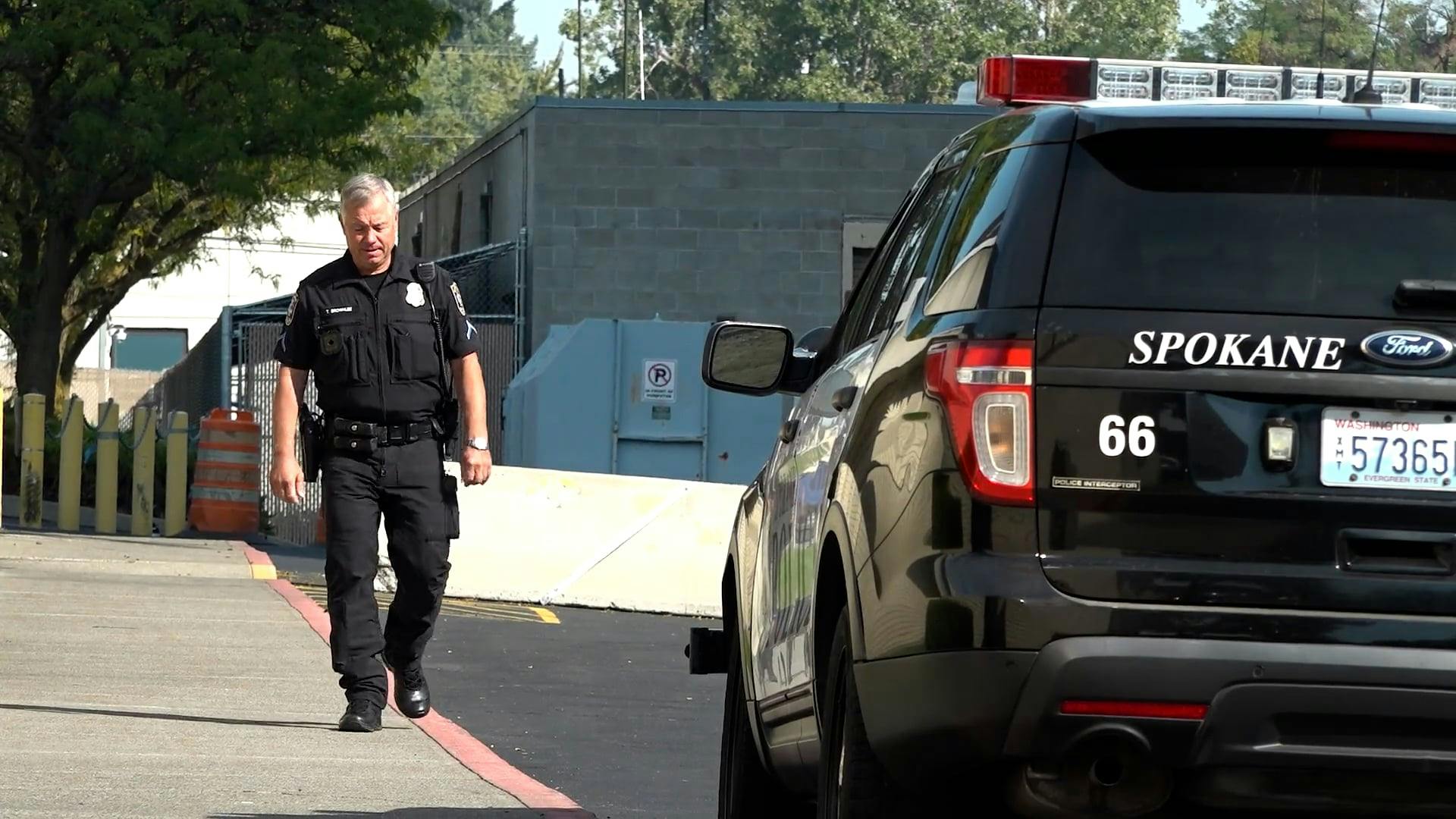 A Police Officer Getting Inside of a Police Car · Free Stock Video