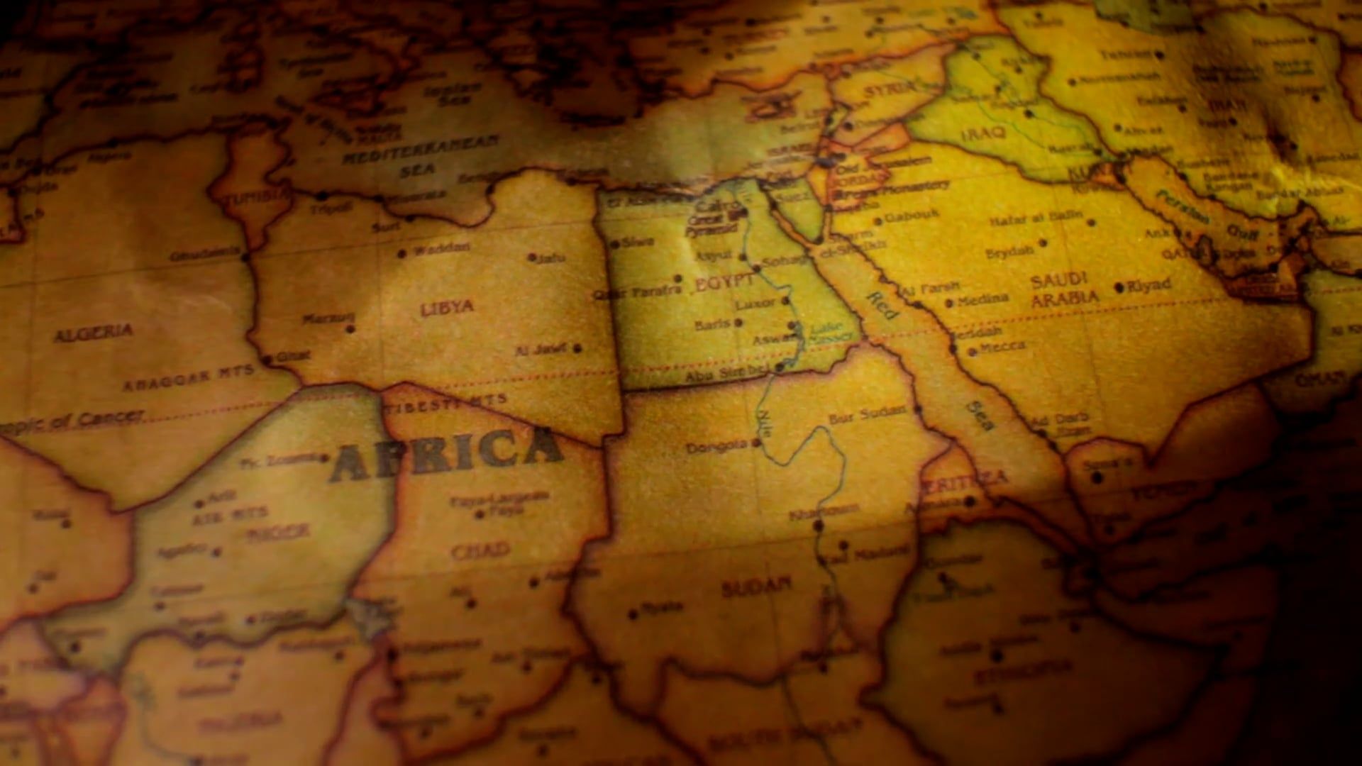 A map with a yellow light shining on it Free Stock Video Footage ...