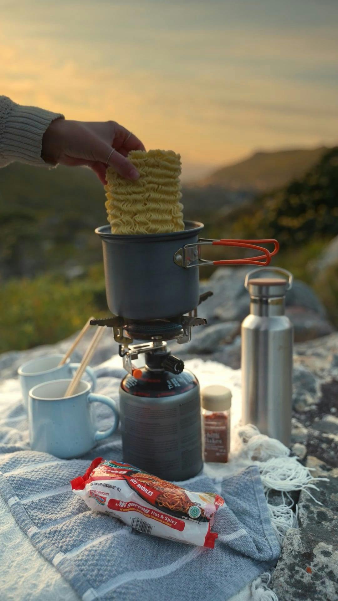 A Person Cooking Instant Noodles on a Camping Stove Free Stock Video ...