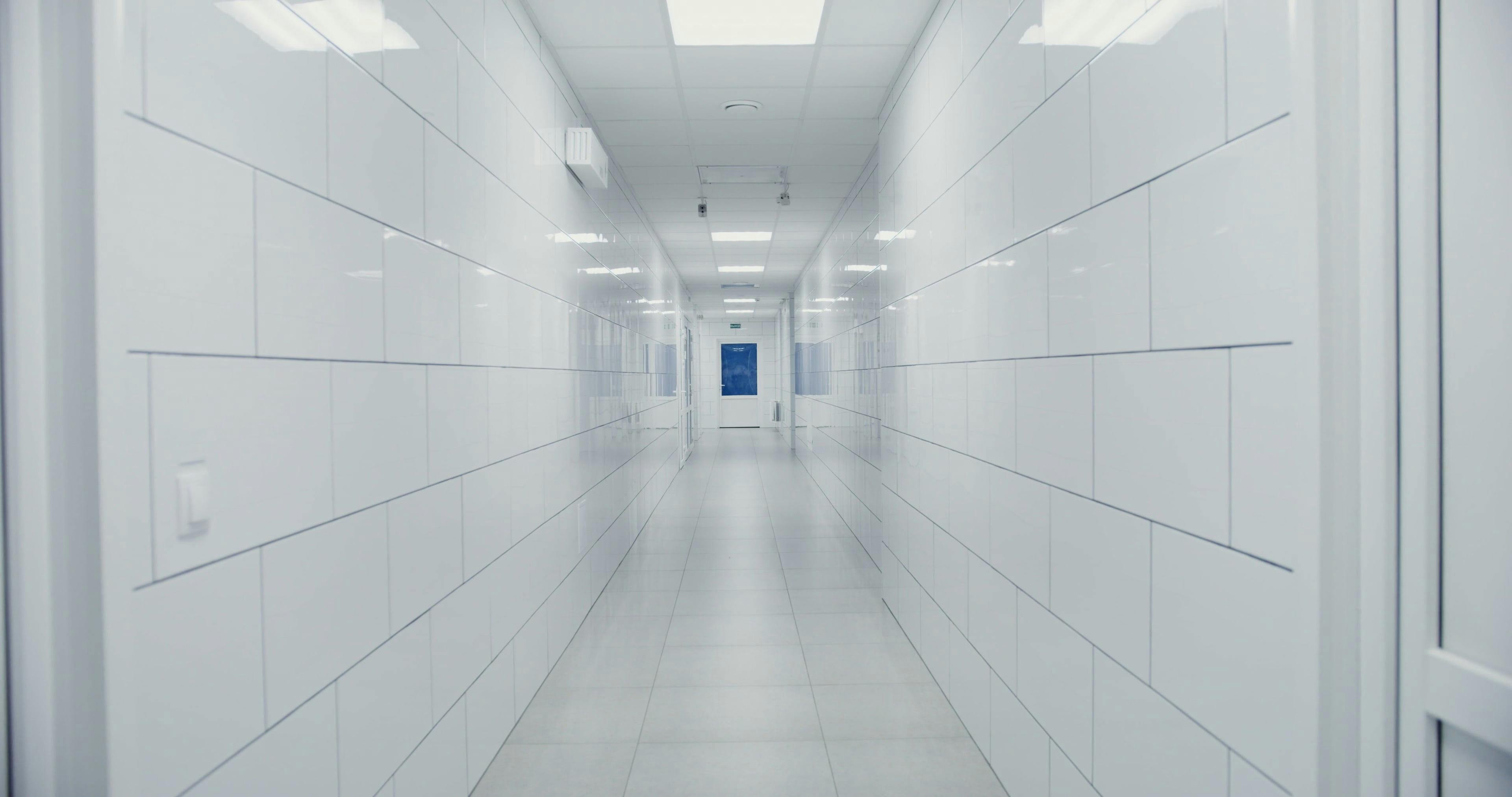 A Person Walking on a Corridor While Pushing a Cart Free Stock Video ...