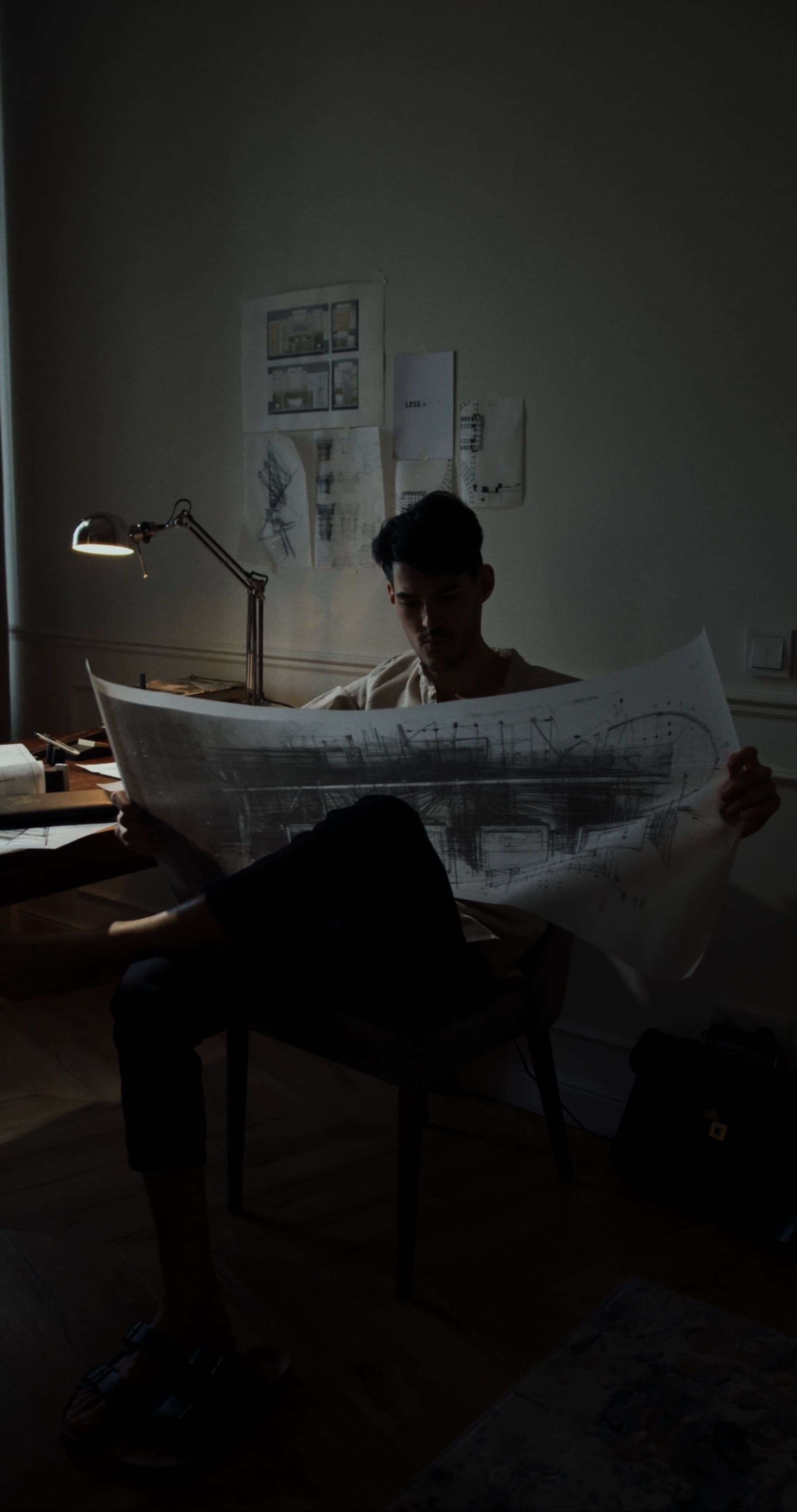 Architect holding design on large sheet of paper Free Stock Video ...