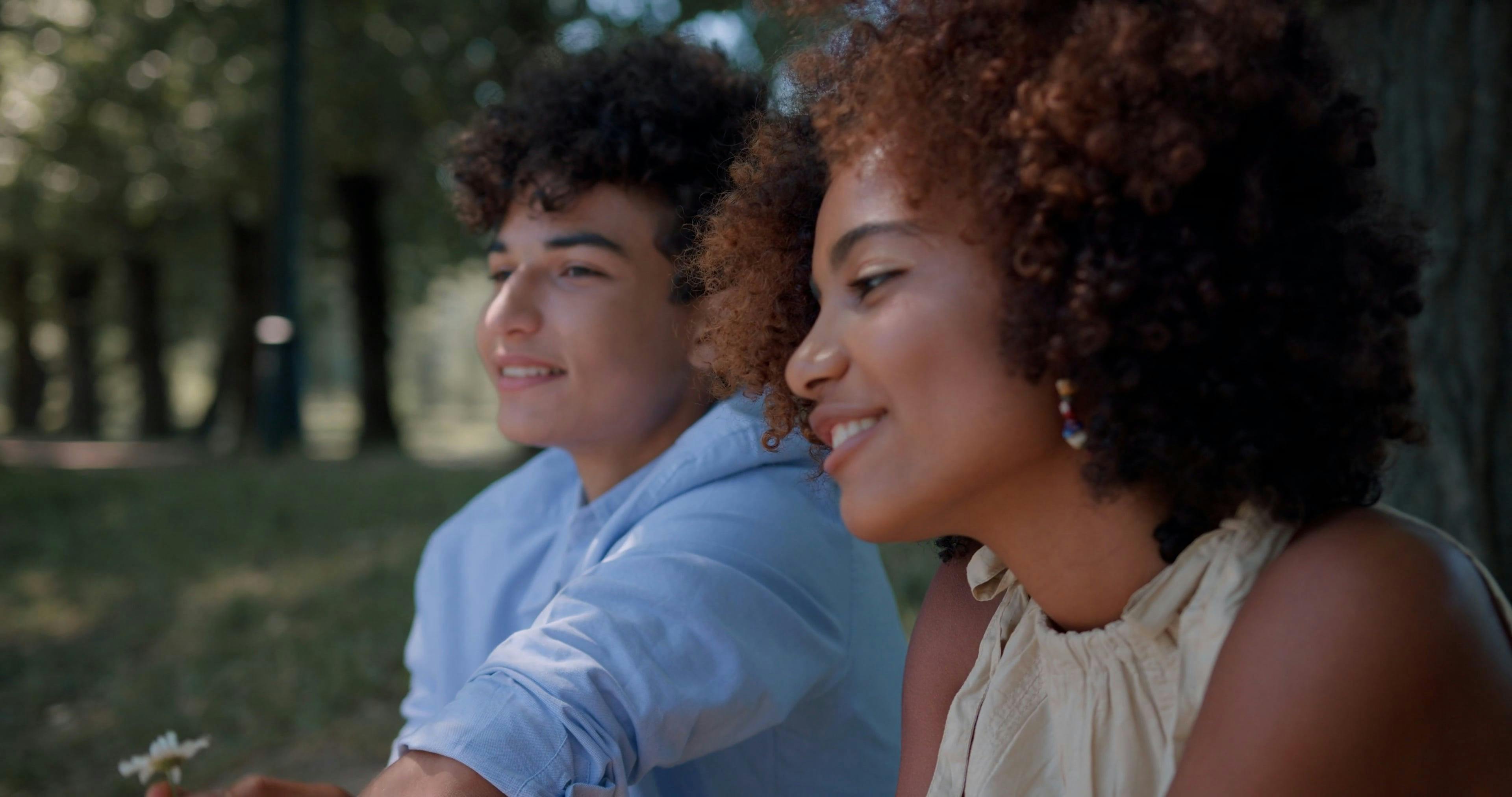 Woman Leaning Head on Man's Shoulder While Smelling a Flower Free Stock ...