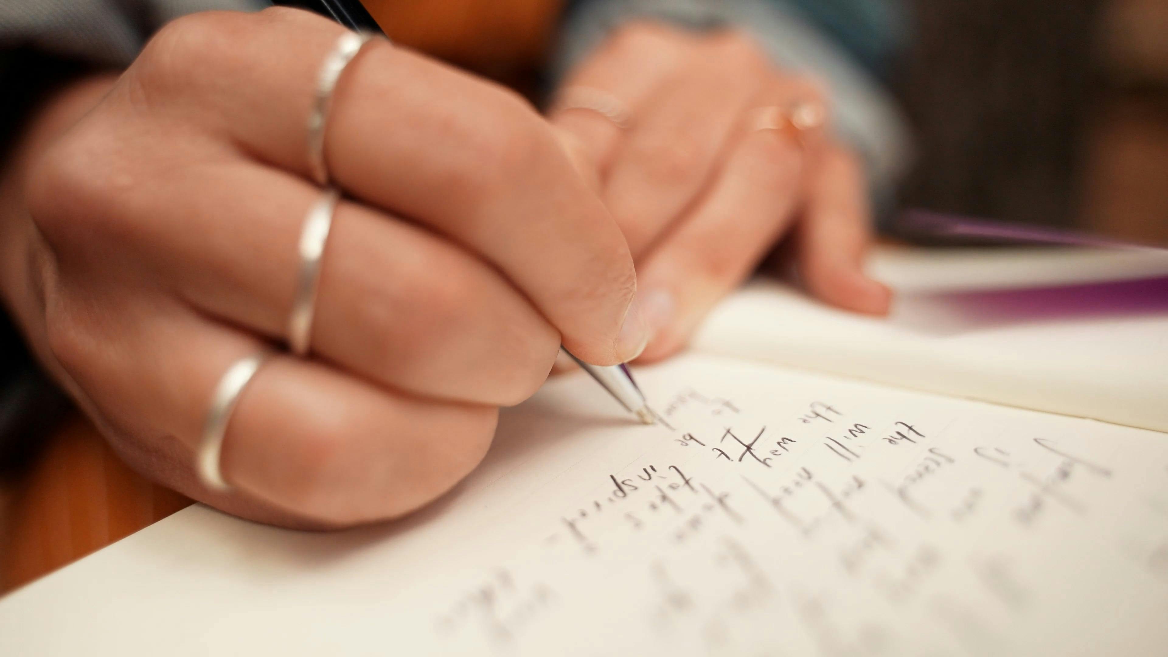 Close-up of a Person Writing · Free Stock Video