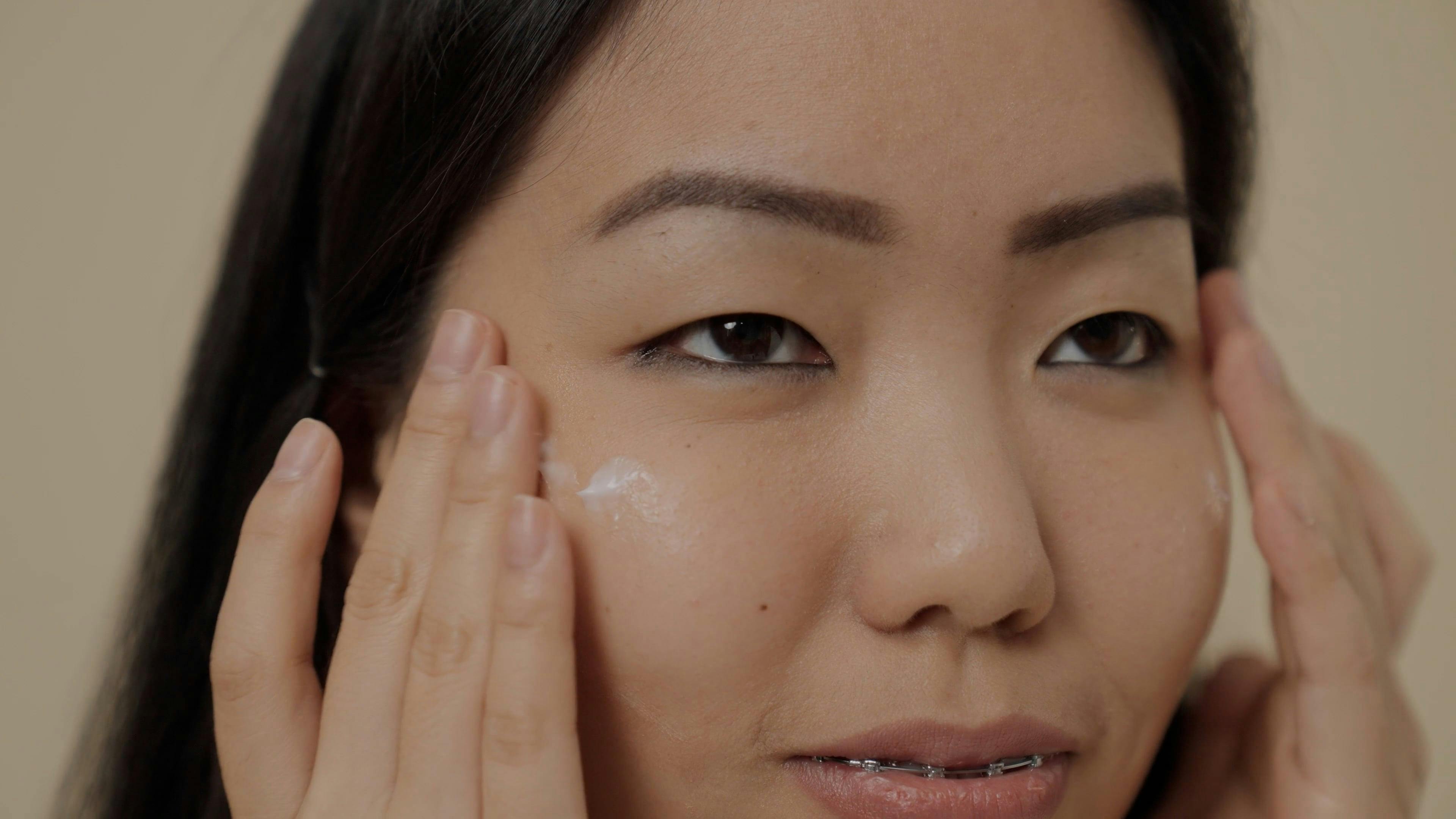 Woman applying cream to face Free Stock Video Footage, Royalty-Free 4K ...