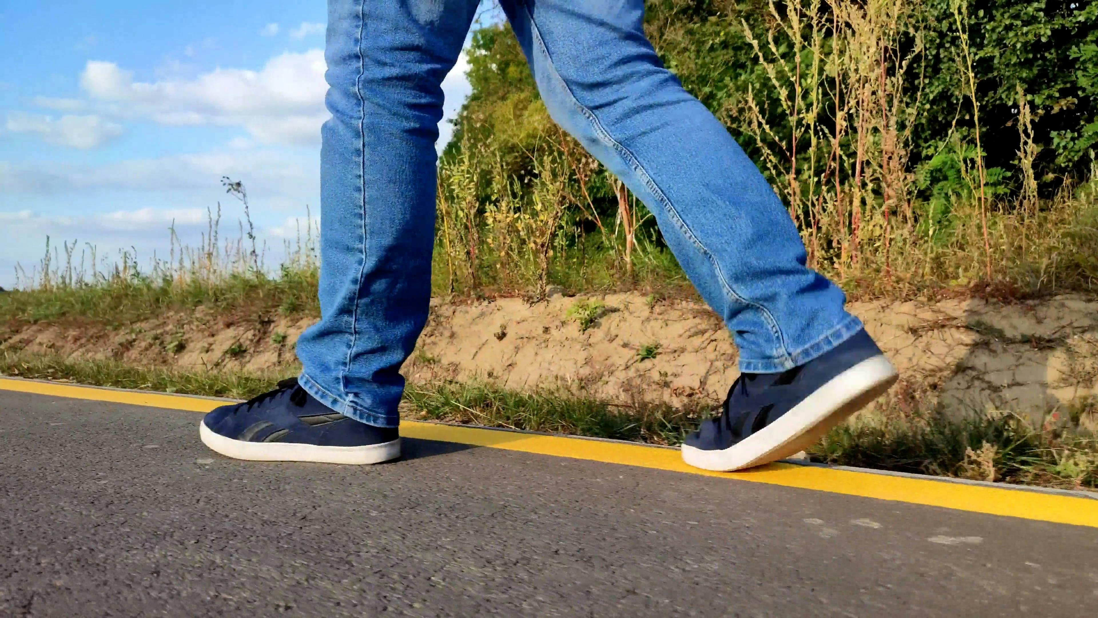 Man walking along road in rural area Free Stock Video Footage, Royalty ...