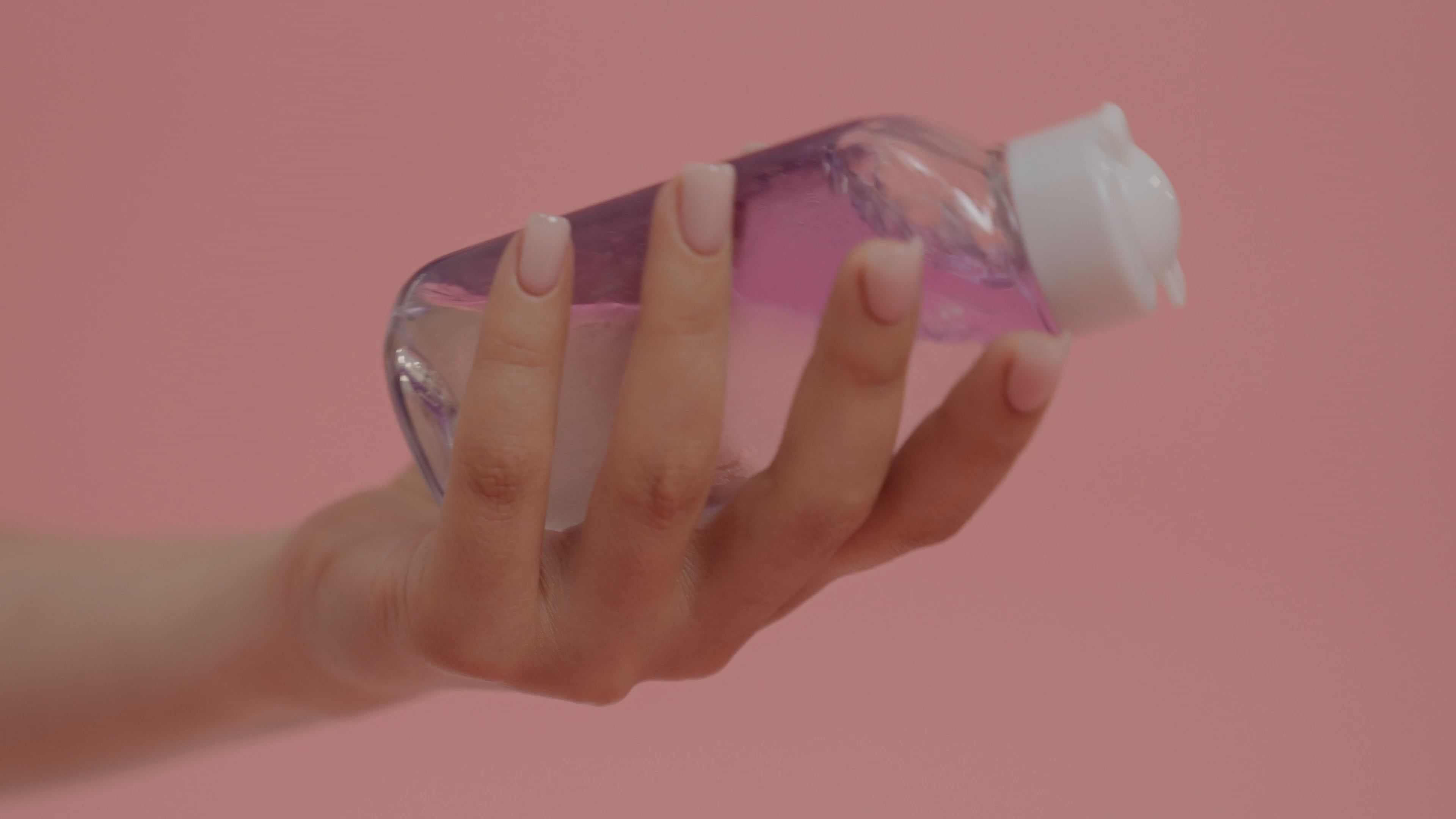 A Person Shaking a Plastic Bottle With Liquid Free Stock Video Footage ...