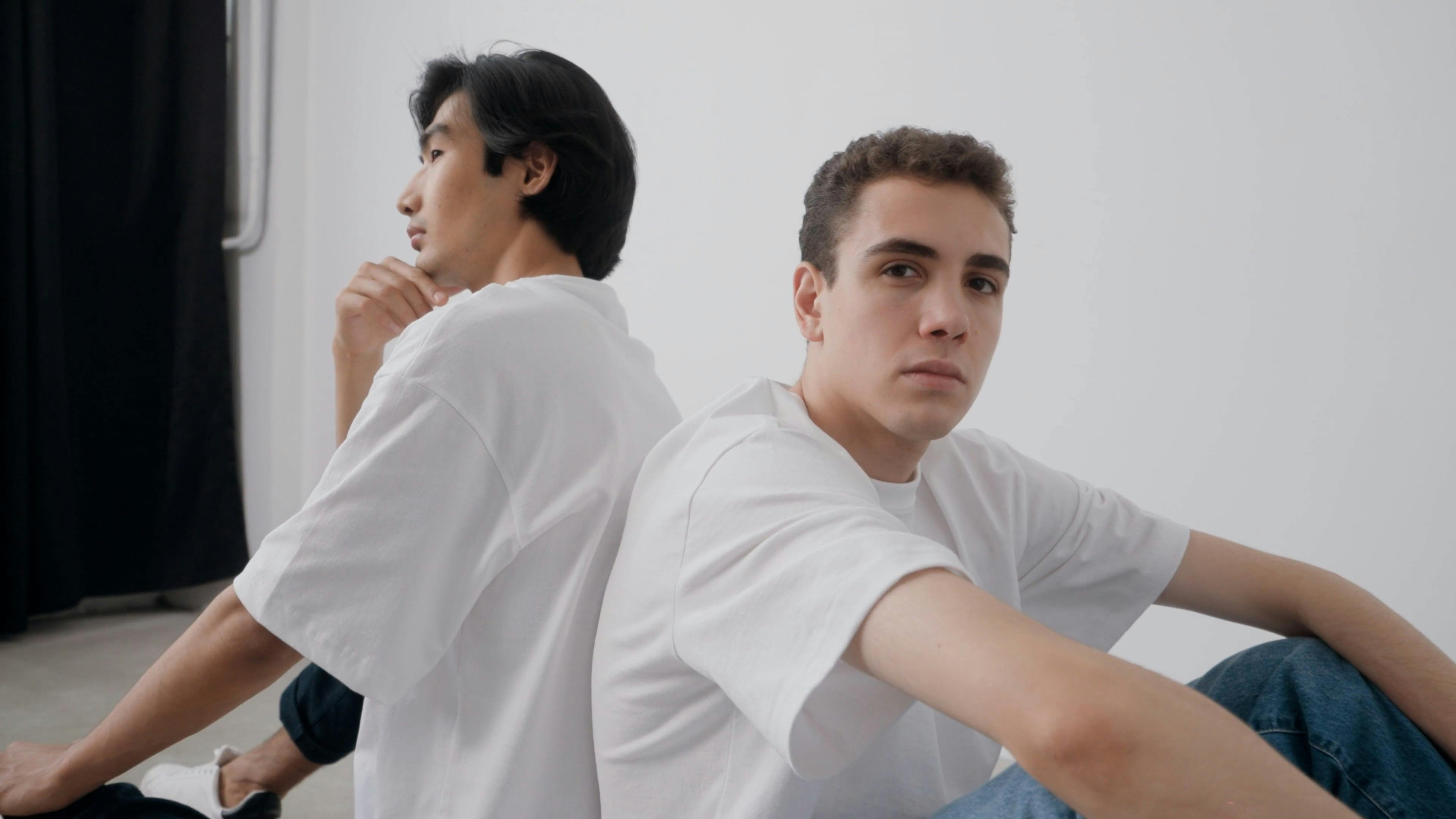 Two young man sitting on floor Free Stock Video Footage, Royalty-Free ...