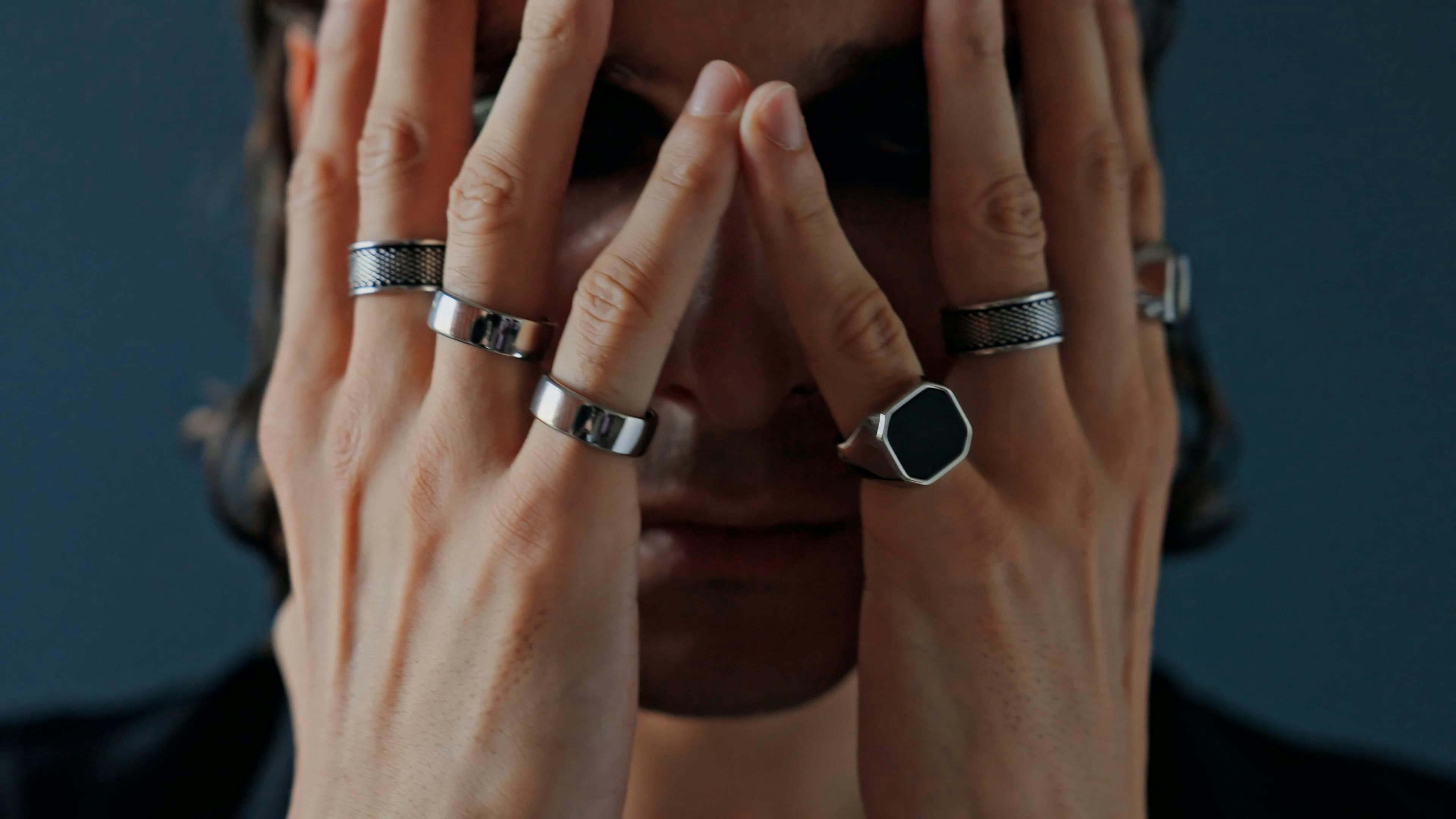 Close-up of man with rings covering face Free Stock Video Footage ...
