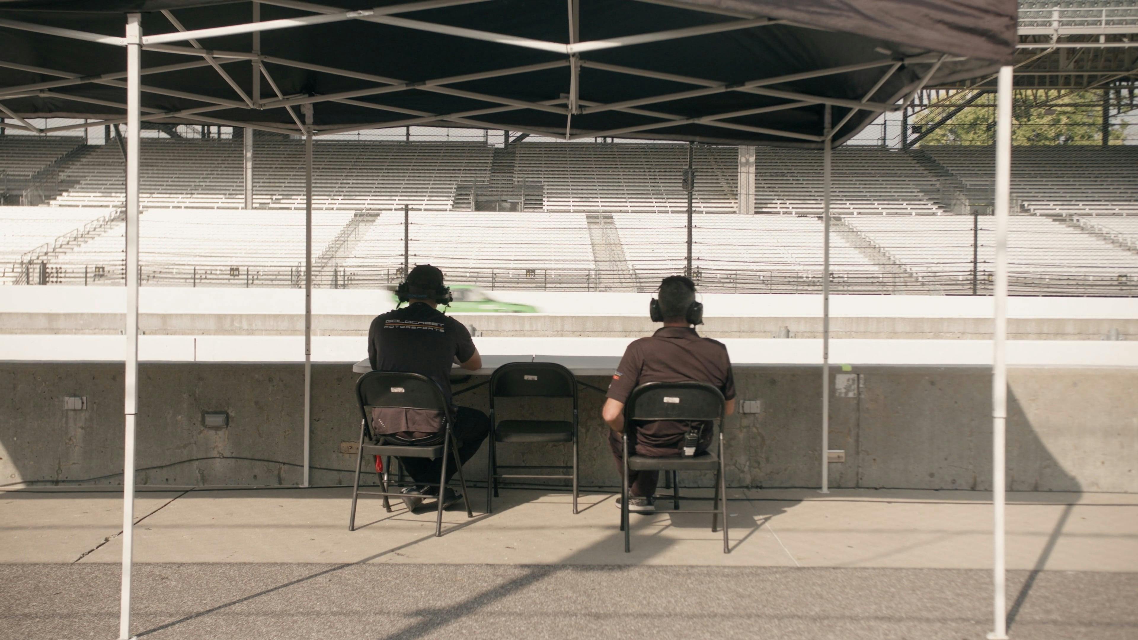 Two men with headphones at motor racing track Free Stock Video Footage ...