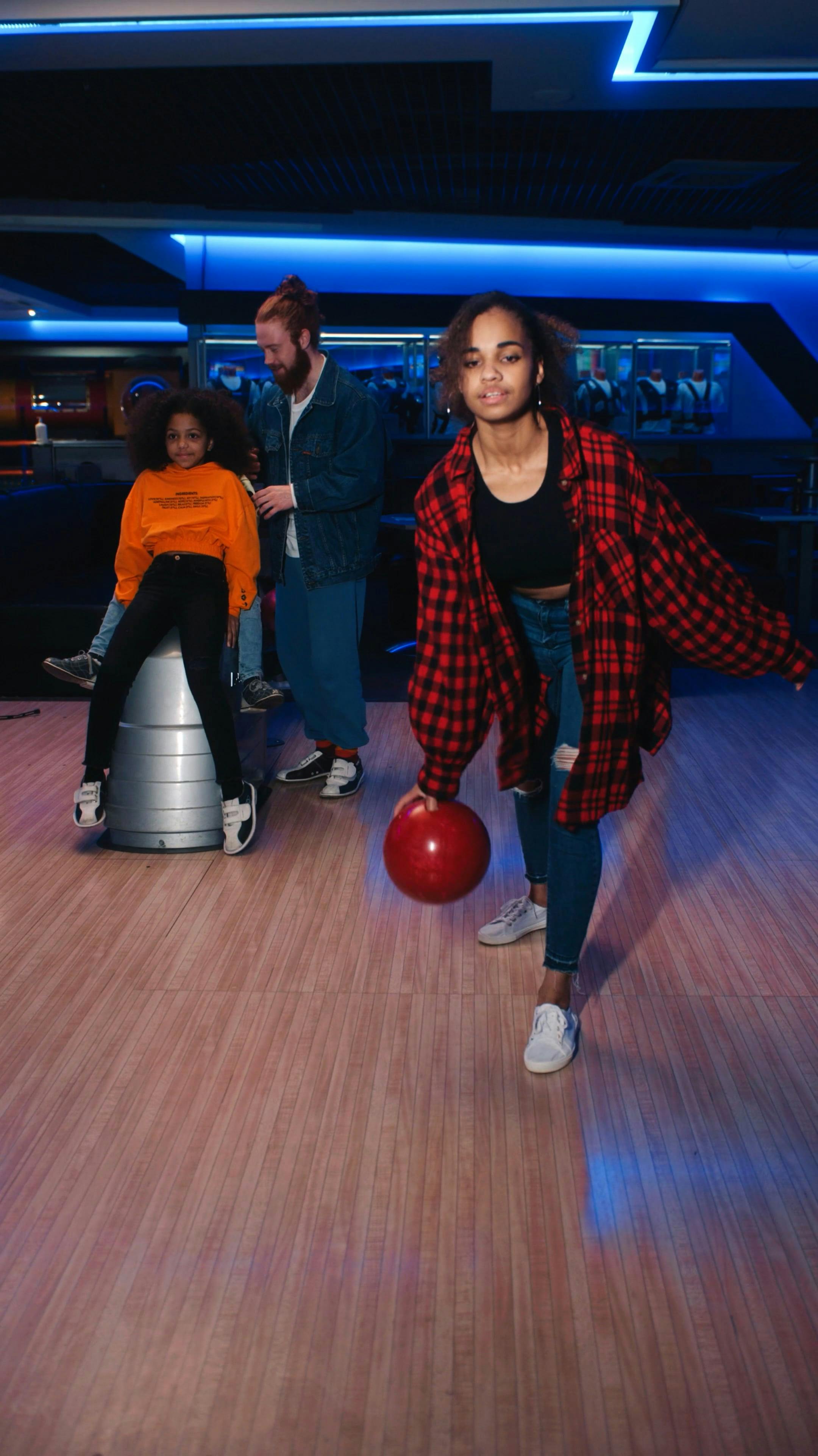 A Young Woman and her Family at a Bowling Alley Free Stock Video ...
