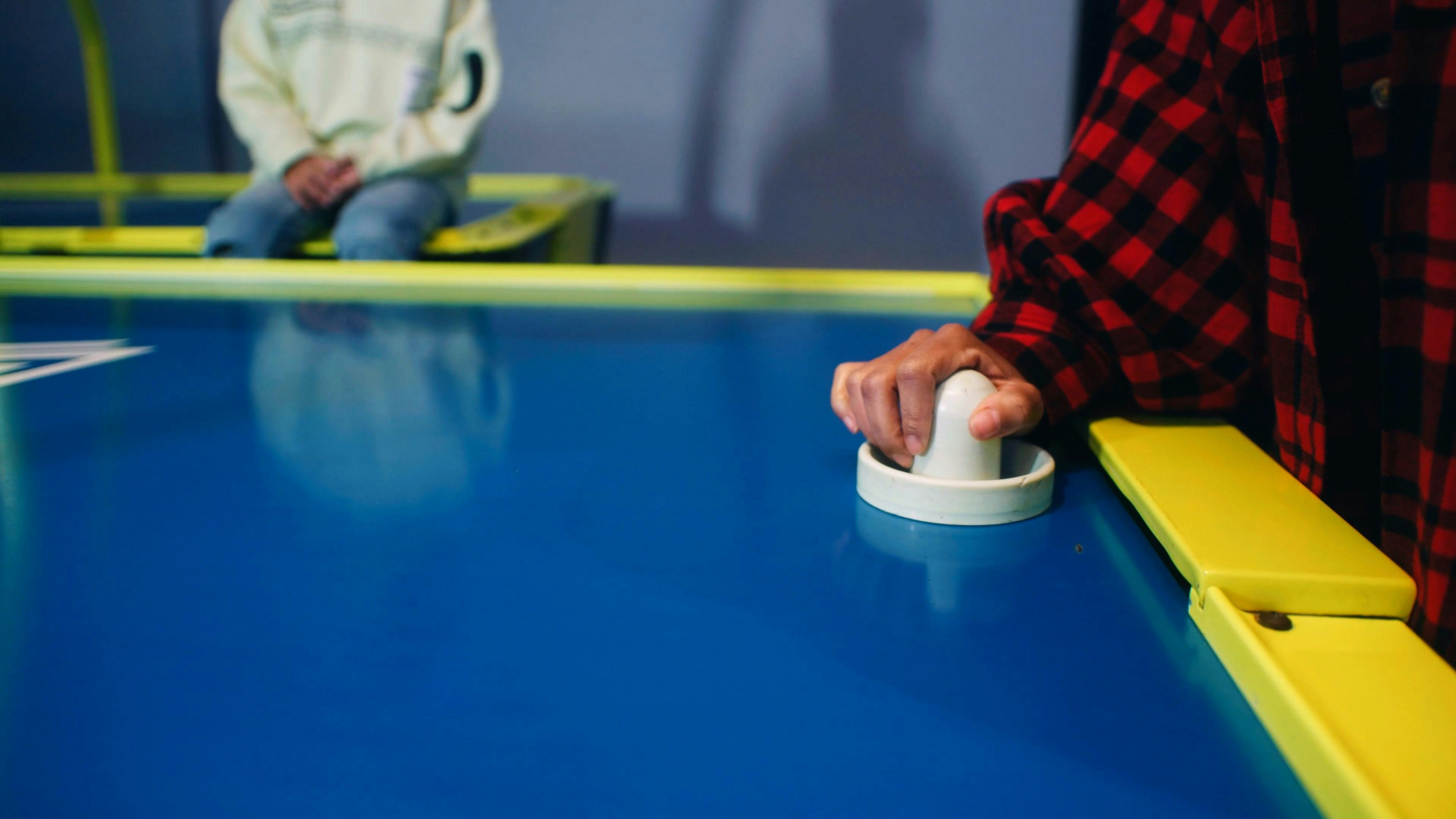 Close-up Footage of a Person Playing Air Hockey Free Stock Video ...
