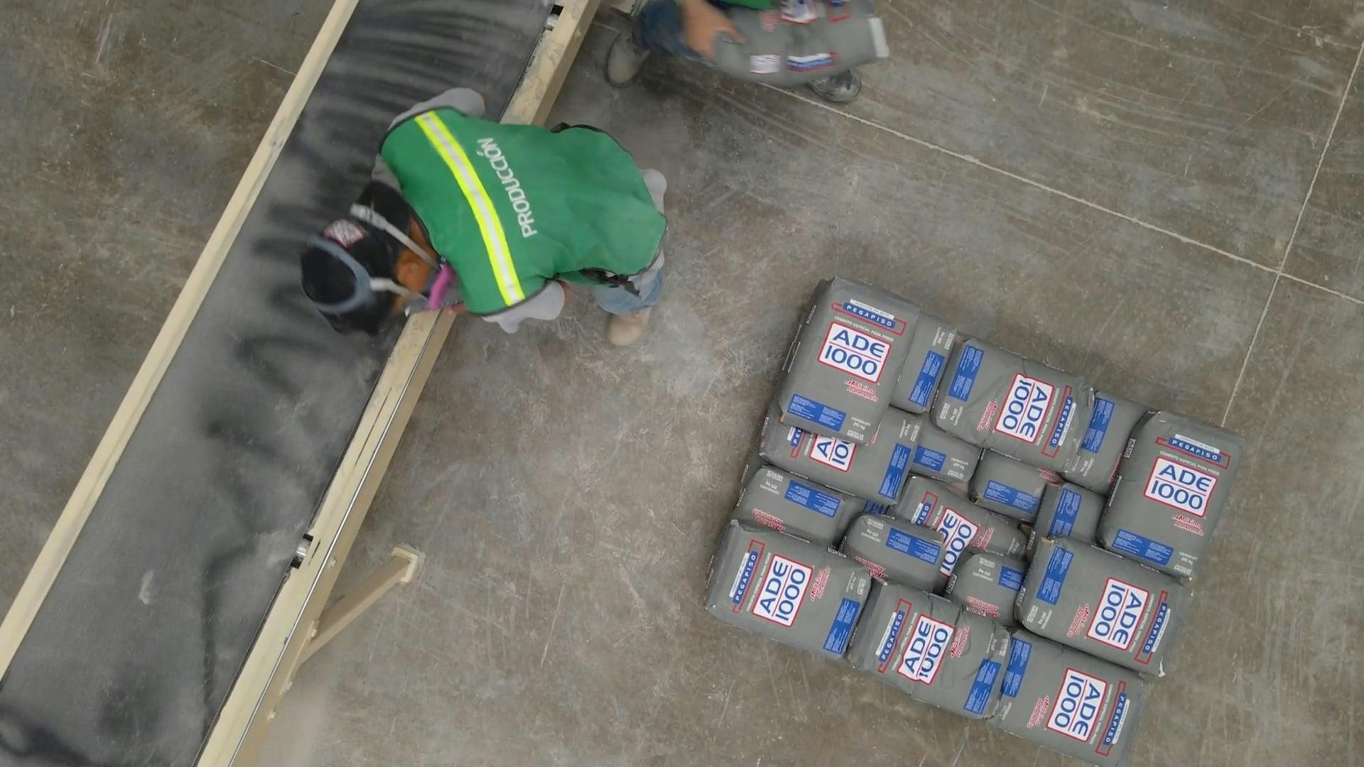 Worker Taking Bag with Construction Product and Laying it on the Pallet ...