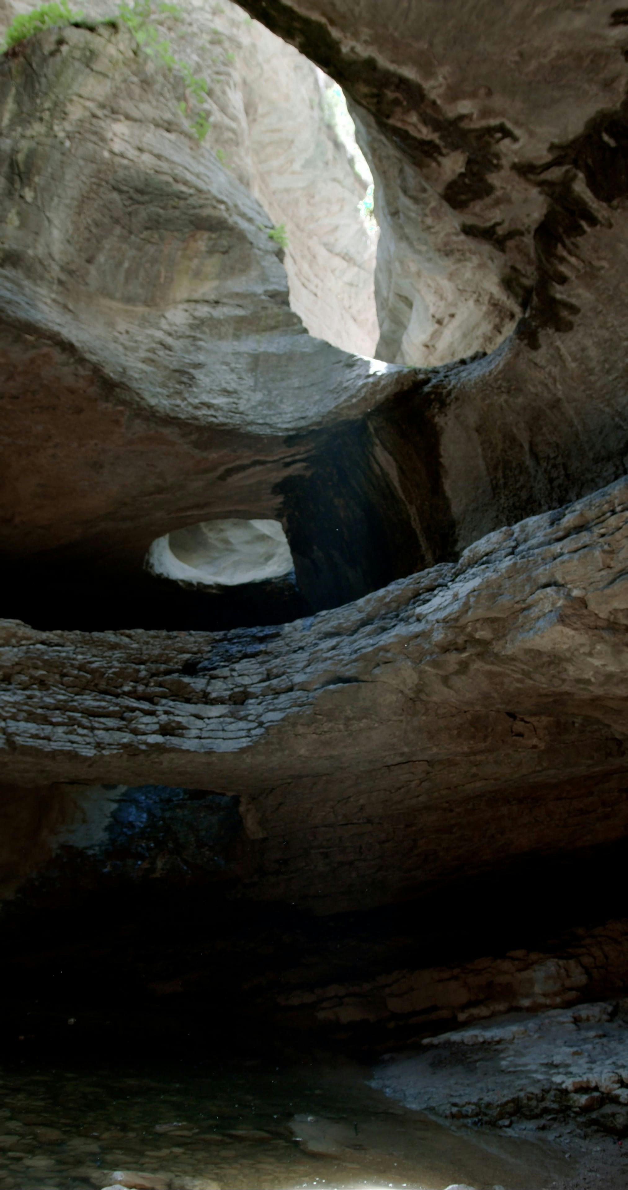 A Woman Walking in a Cave Free Stock Video Footage, Royalty-Free 4K ...