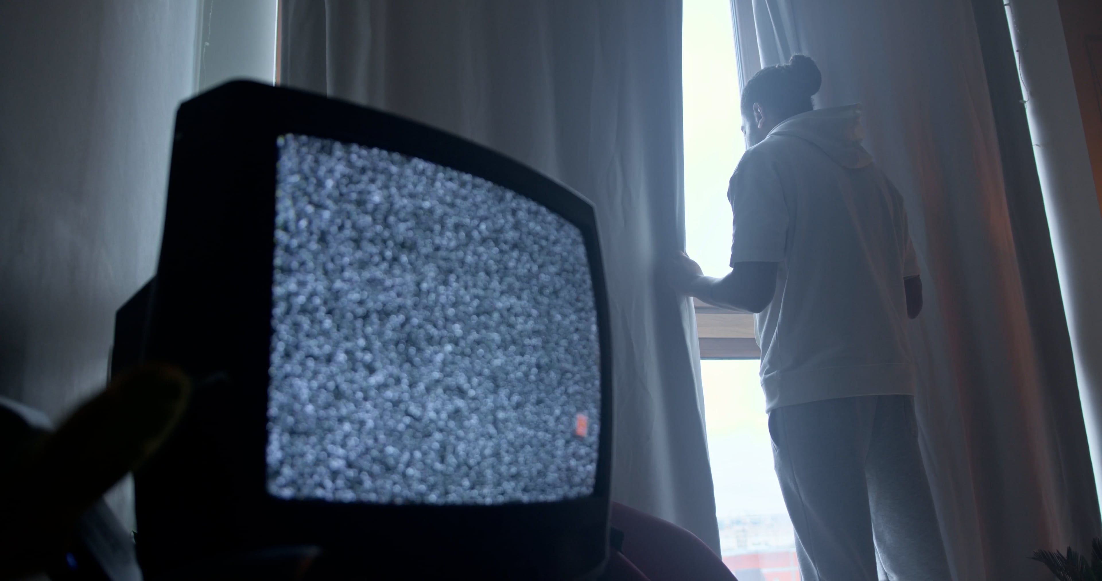 Static on TV and Man Looking Through Window Free Stock Video Footage ...