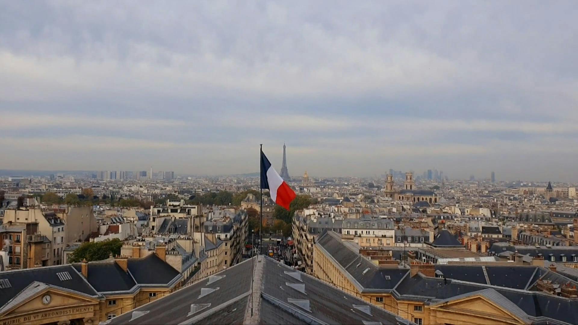 French Flag on Roof of Building · Free Stock Video
