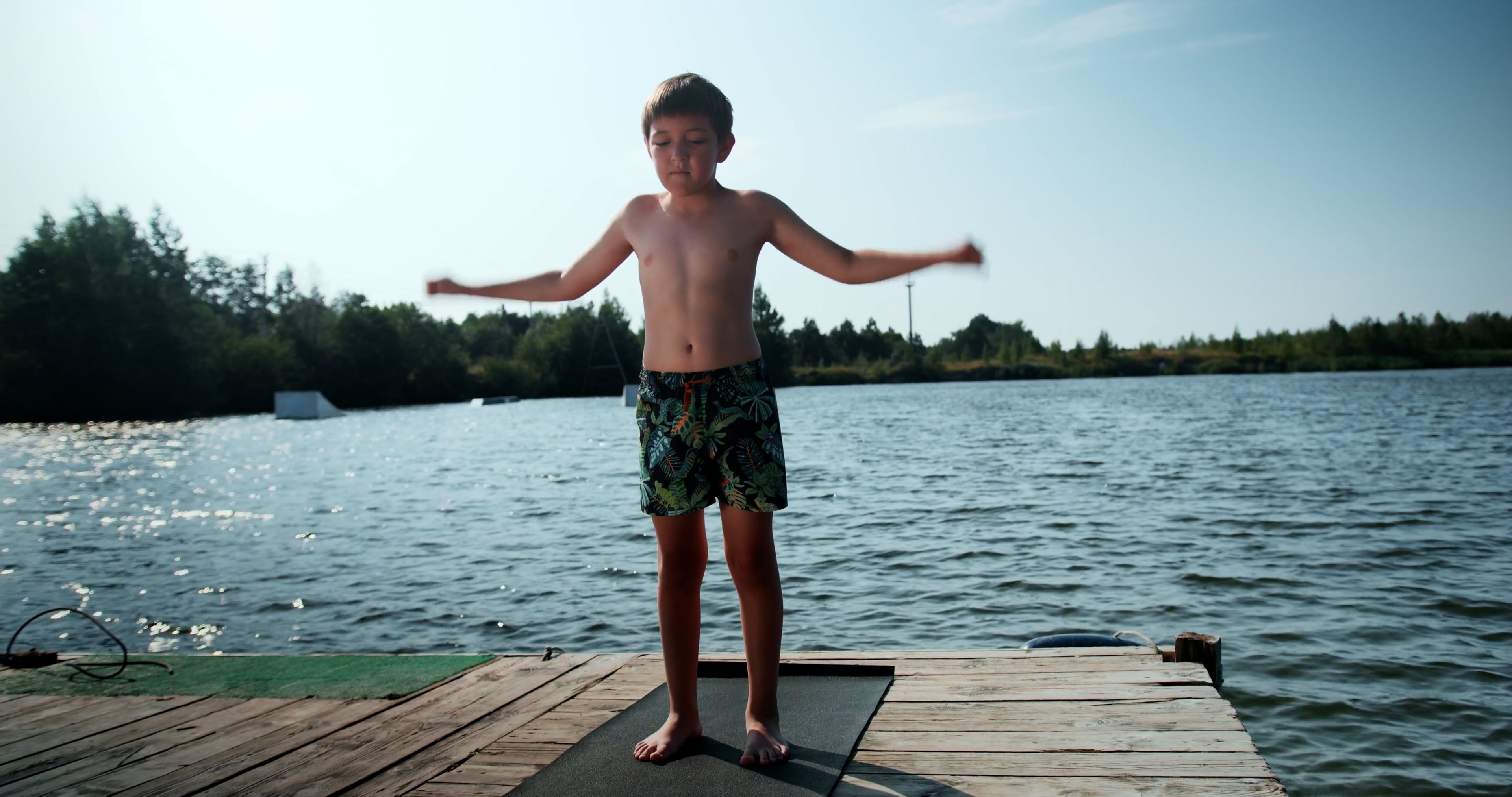 Boy During Warming Up Exercises on Jetty Free Stock Video Footage ...