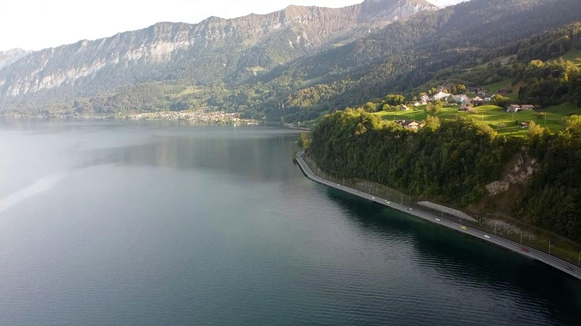 Mountain Range over Lake and Road near It Free Stock Video Footage ...